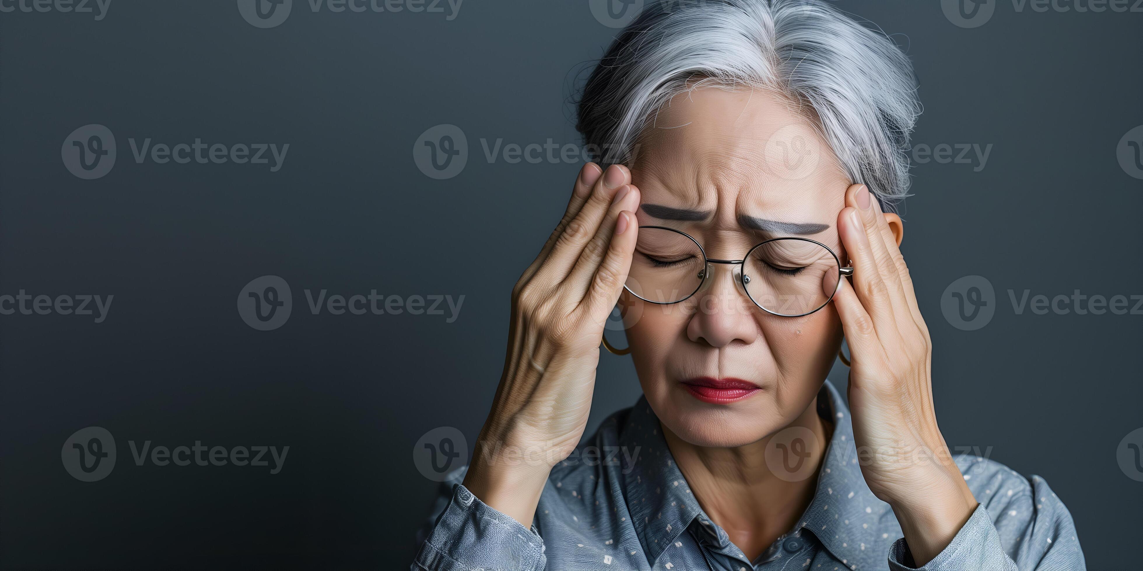 AI generated Asian elder woman suffering dizziness, vertigo, headache, fainting attack or stress ...