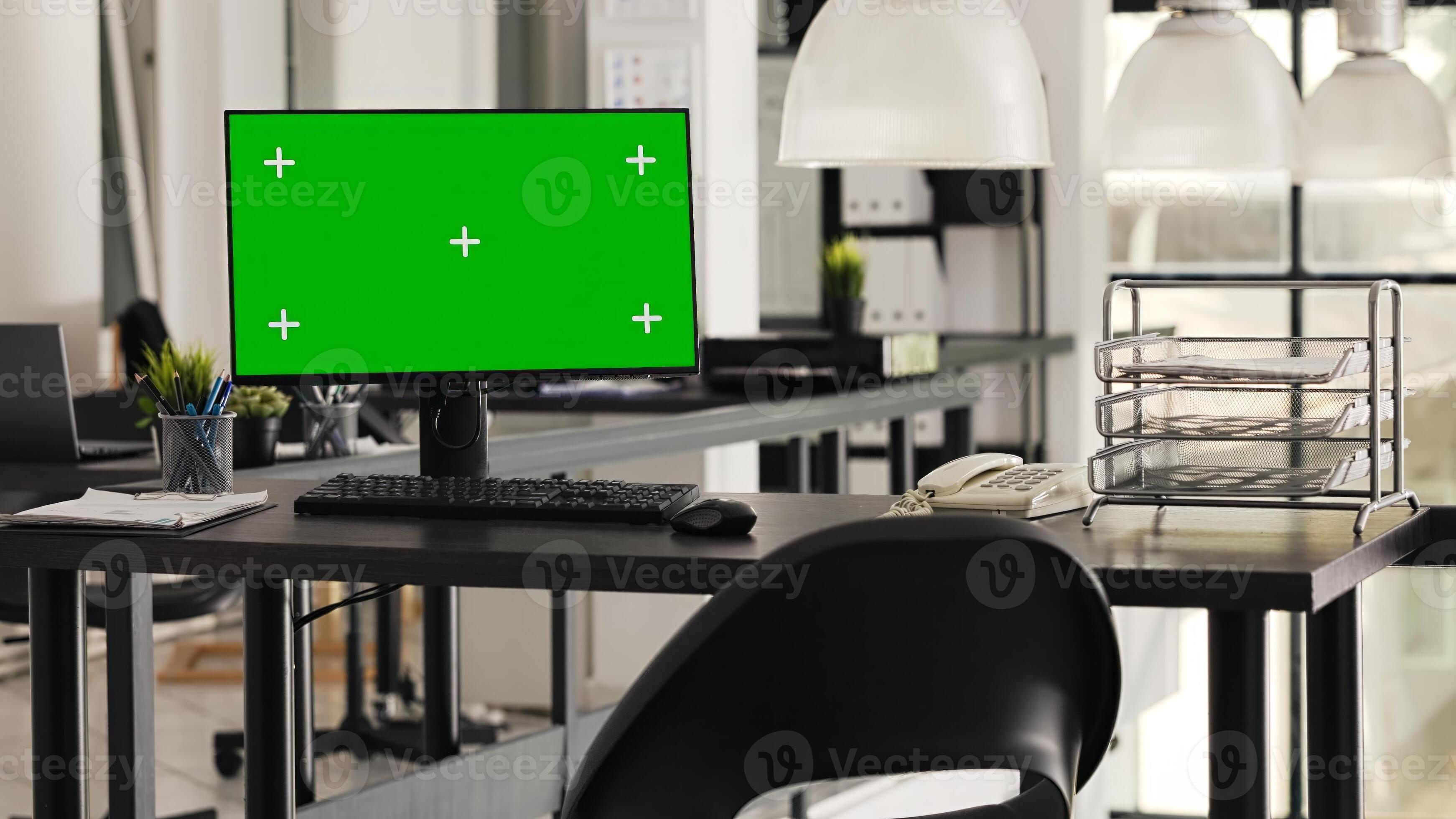 Greenscreen display placed on office desk used for business operations in startup space, empty ...