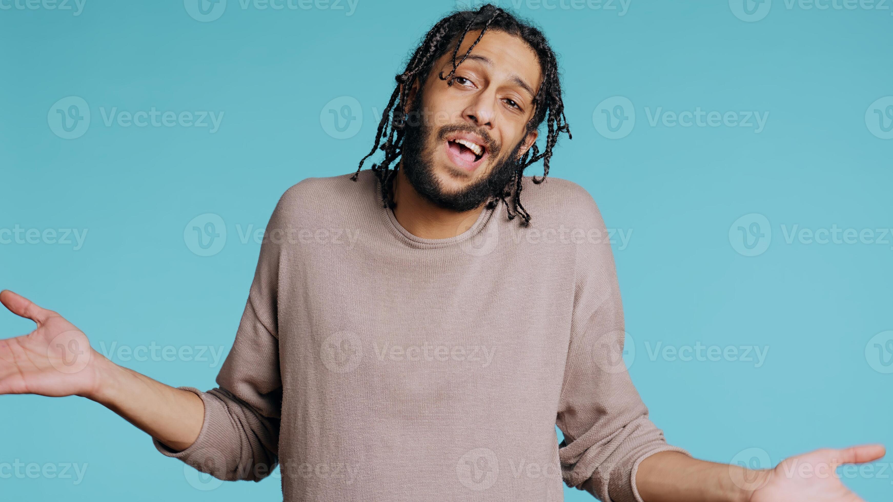 Uncaring Middle Eastern man shrugging shoulders, showing indifference ...