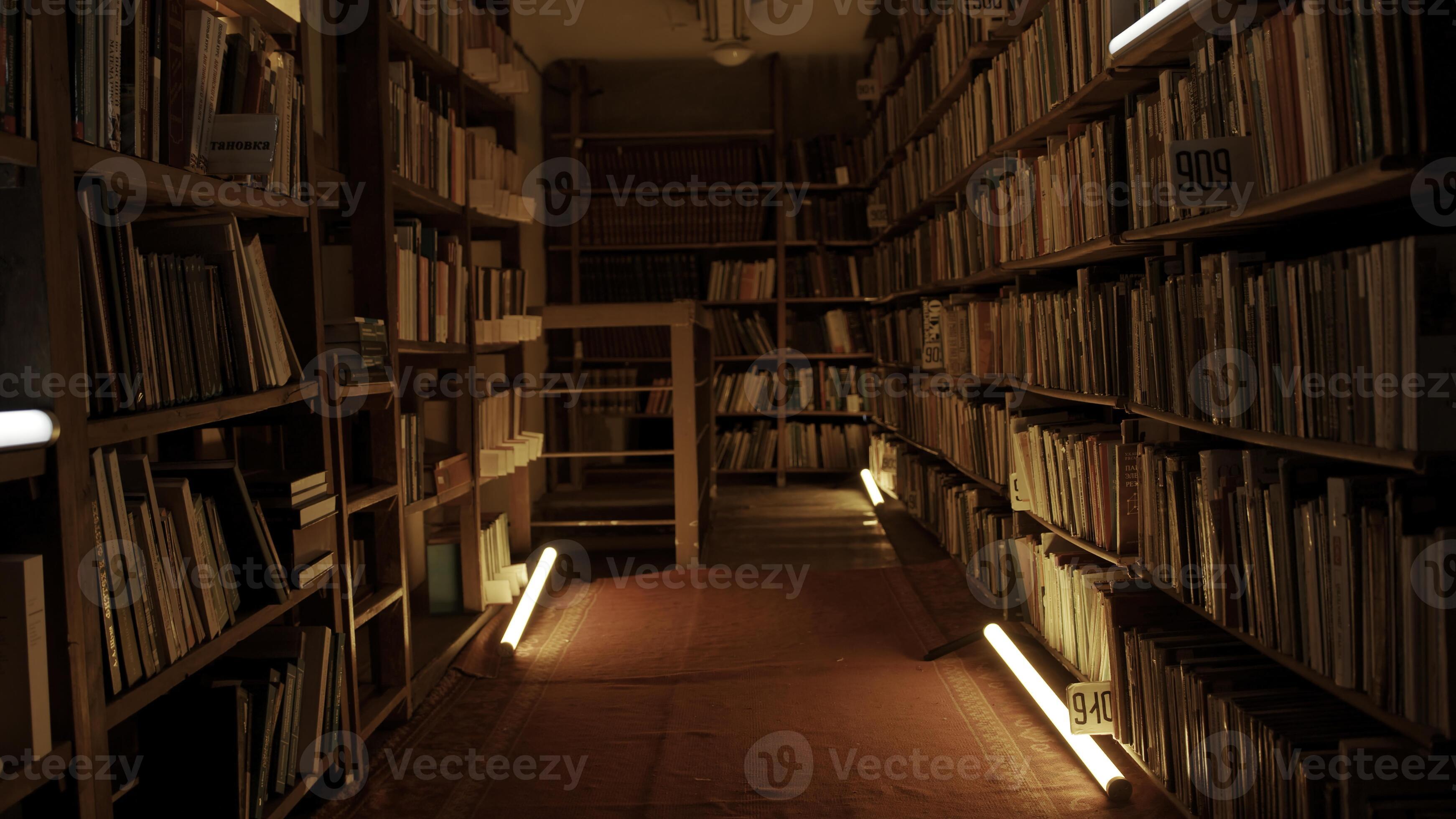 Night library with flashing lights. Stock footage. Corridor with ...