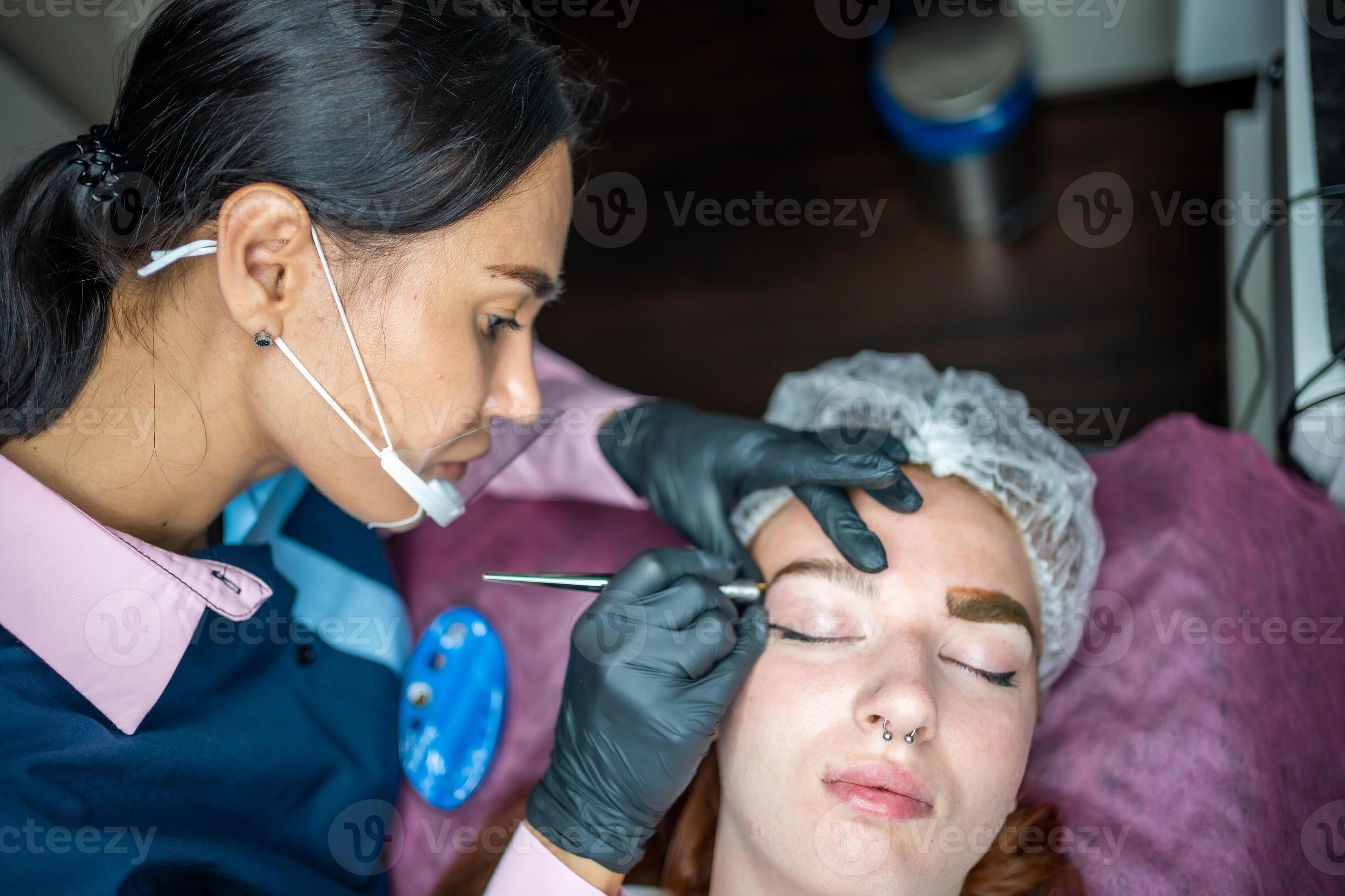 Procedure Of Eyebrow Microblading A Master In Black Gloves Is Doing A Blending Needle Of Model