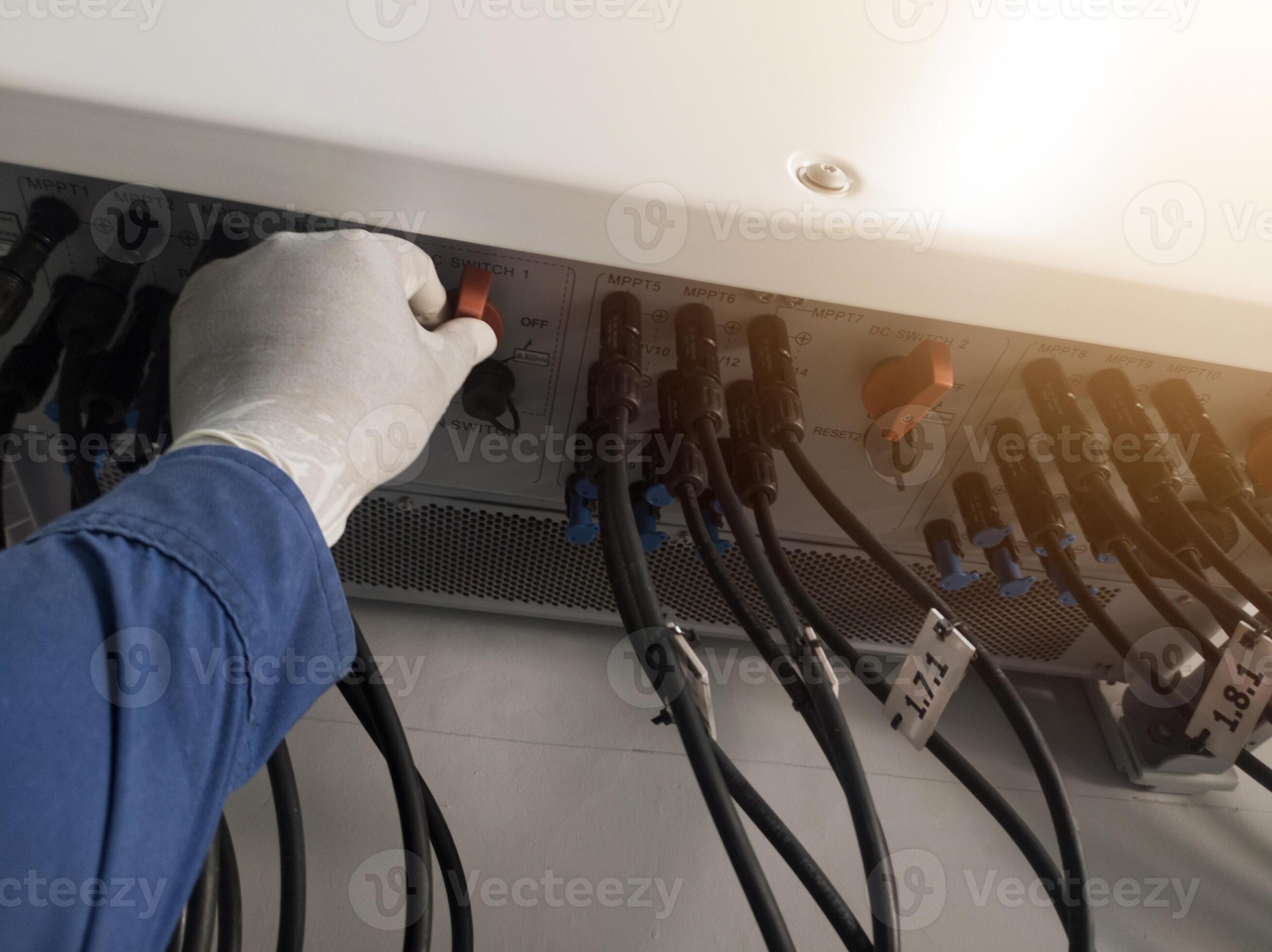 A engineering checking string cable lines in inverter solar panel.The ... A engineering checking string cable lines in inverter solar panel.The ...
