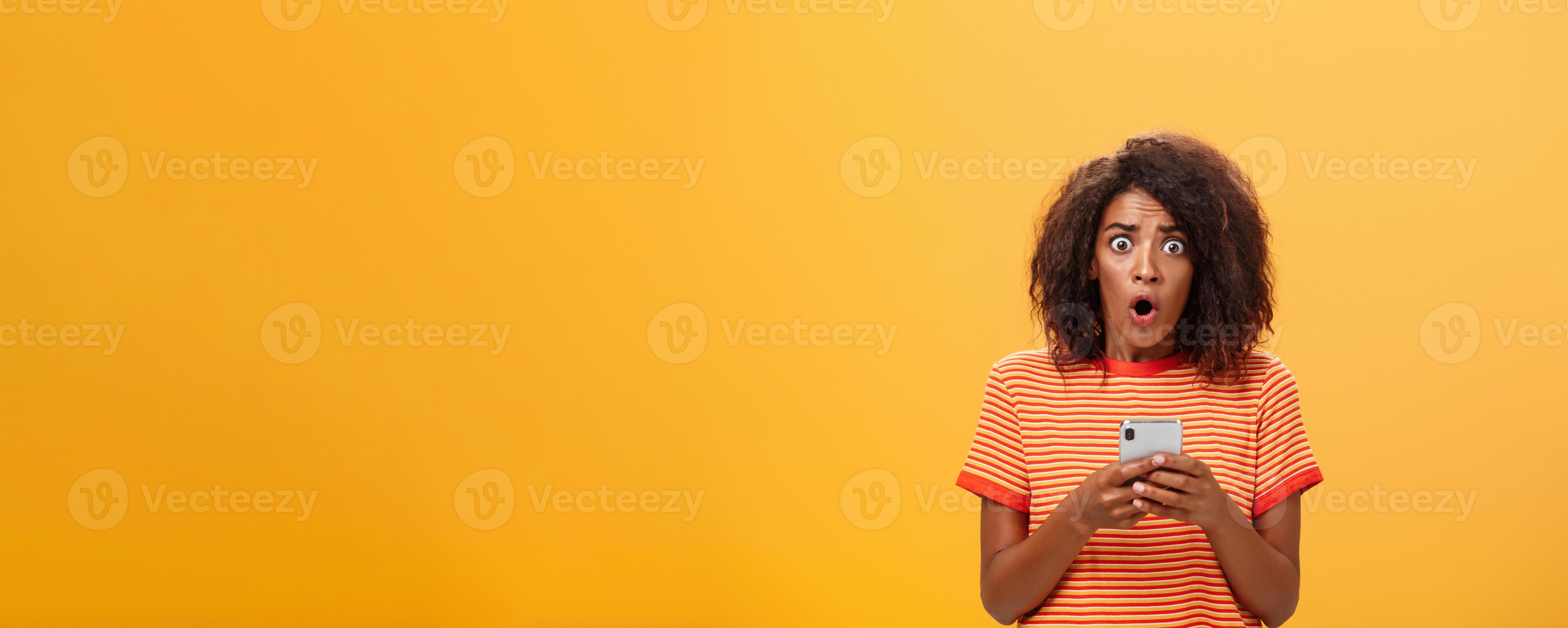 Portrait Of Shocked And Concerned Stunned Dark Skinned Woman With Afro
