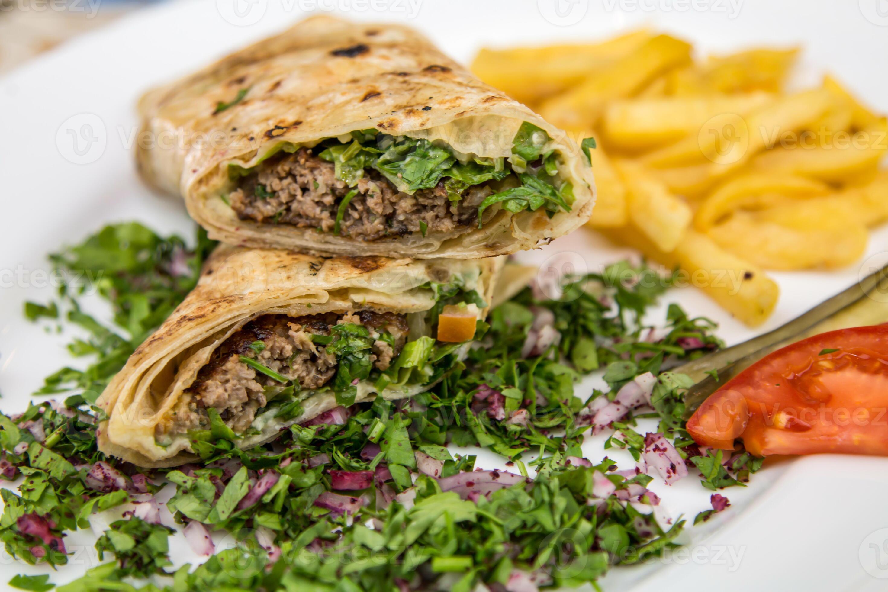 Meat Kabab Sandwich shawarma wrap filled with onion, tomato served in ...