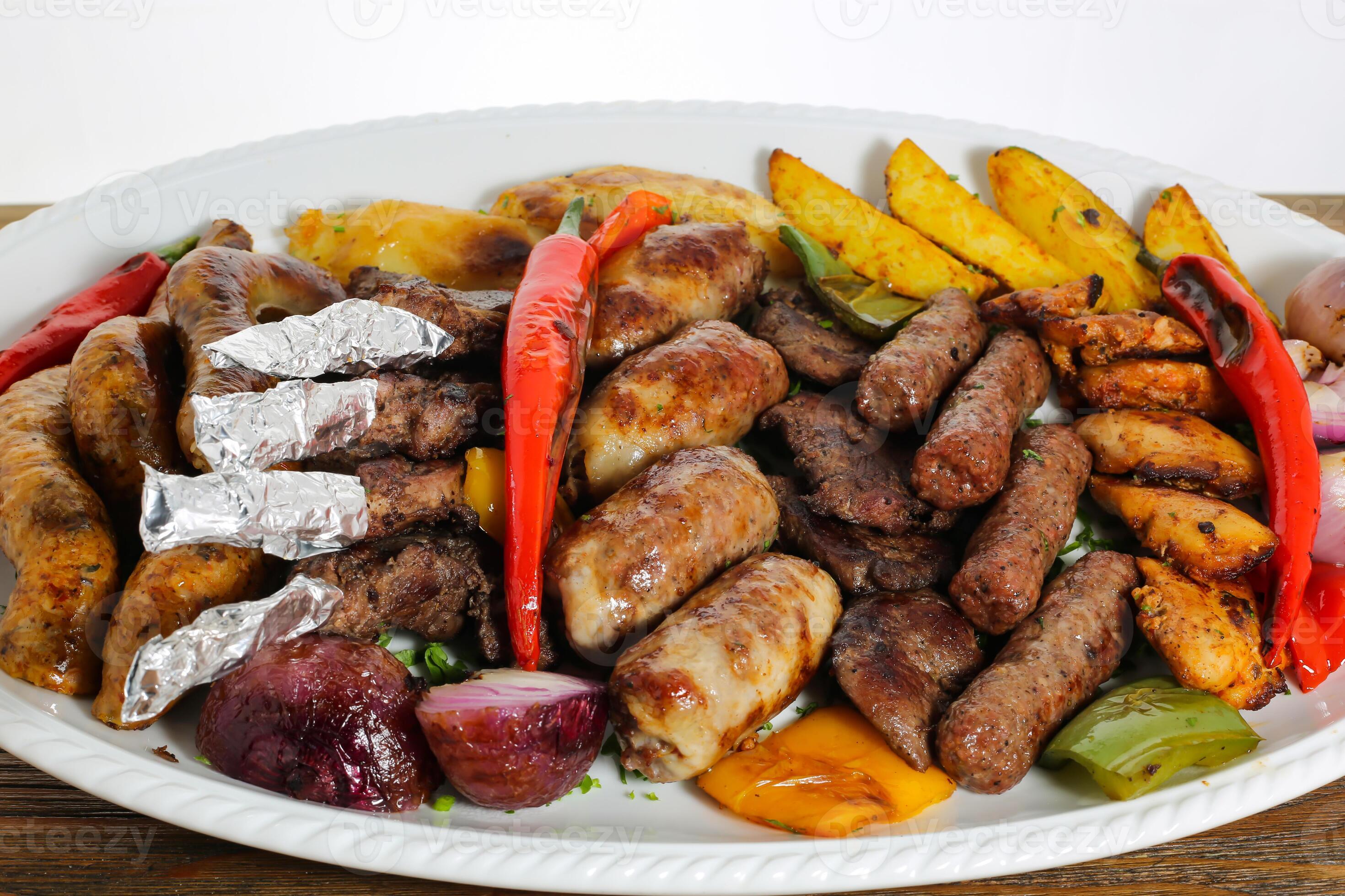 Mix grill family platter tikka kabab, lamb chop, meat kebab, chicken ...