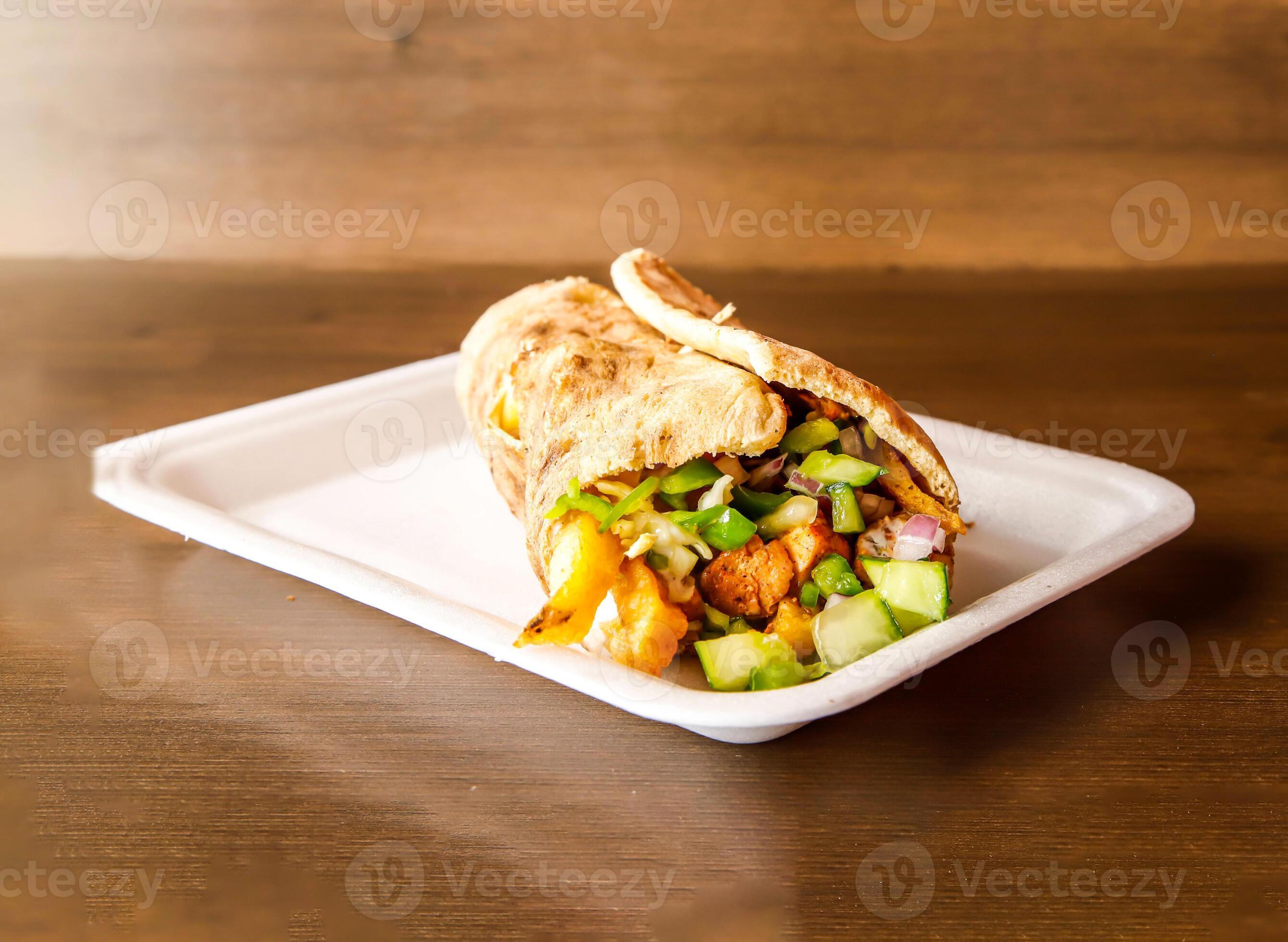 afghani burrito shawarma filled with chicken, cucumber and onion served ...