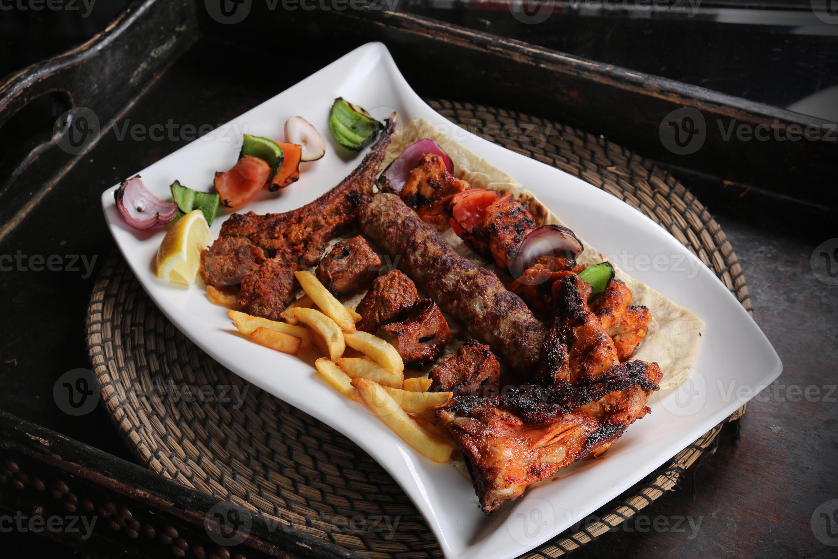 Mix grill with lamb chop, chicken tikka, shish tawook, beef kabab ...