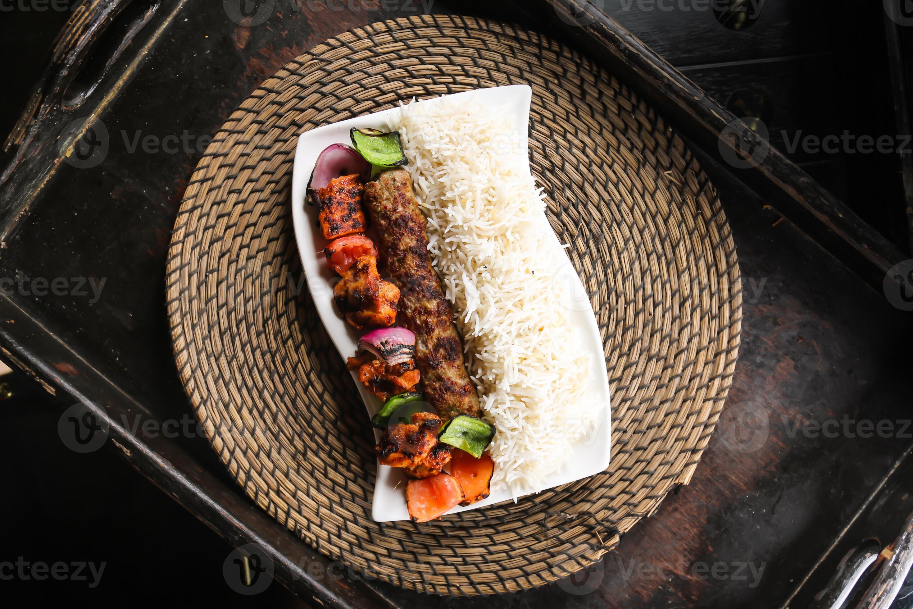 Chelo kabab or chello kebab with chicken tikka and rice served in dish ...
