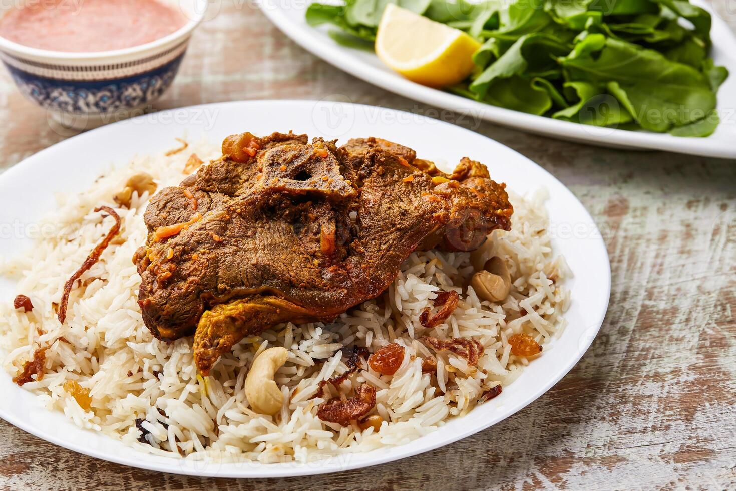 Madfoon Meat mandi rice served in dish isolated on table top view of ...