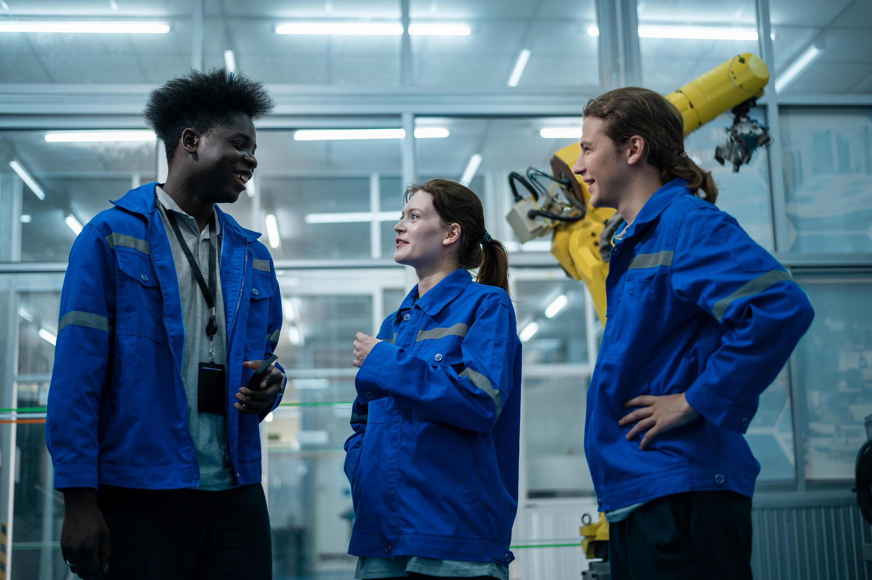 Portrait of Robotics engineers working with Programming and ...