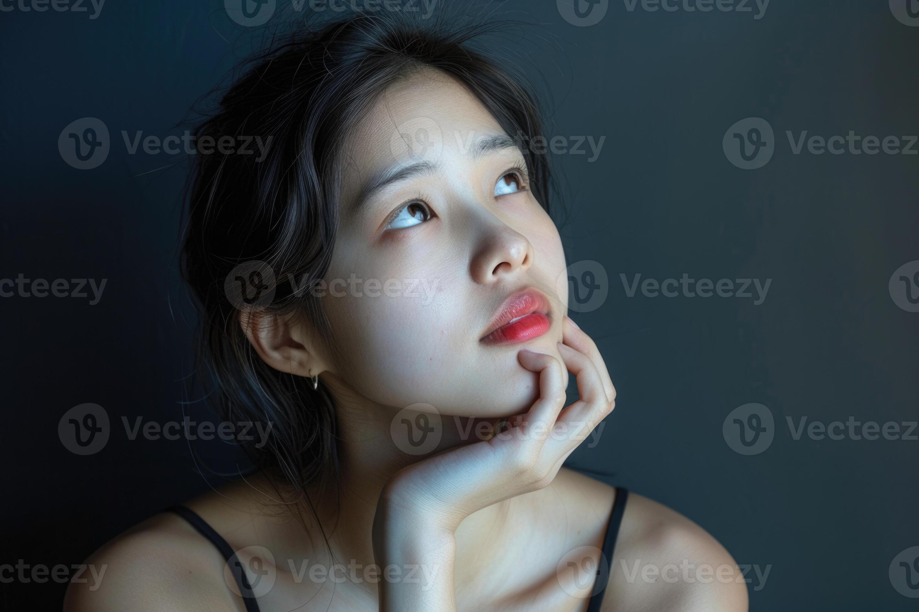 Portrait of thinking young Asian woman looking up and touch chin 43500847 Stock Photo at Vecteezy