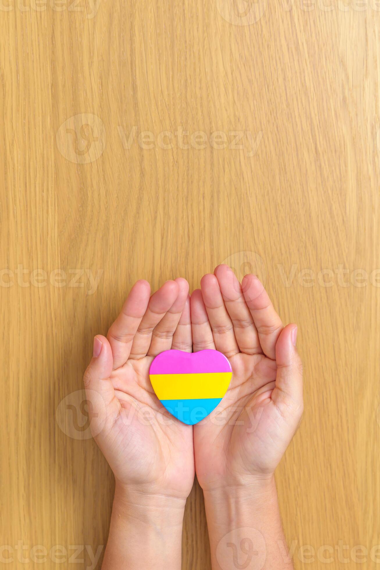 Pansexual Pride Day And Lgbt Pride Month Concept Hand Holding Pink