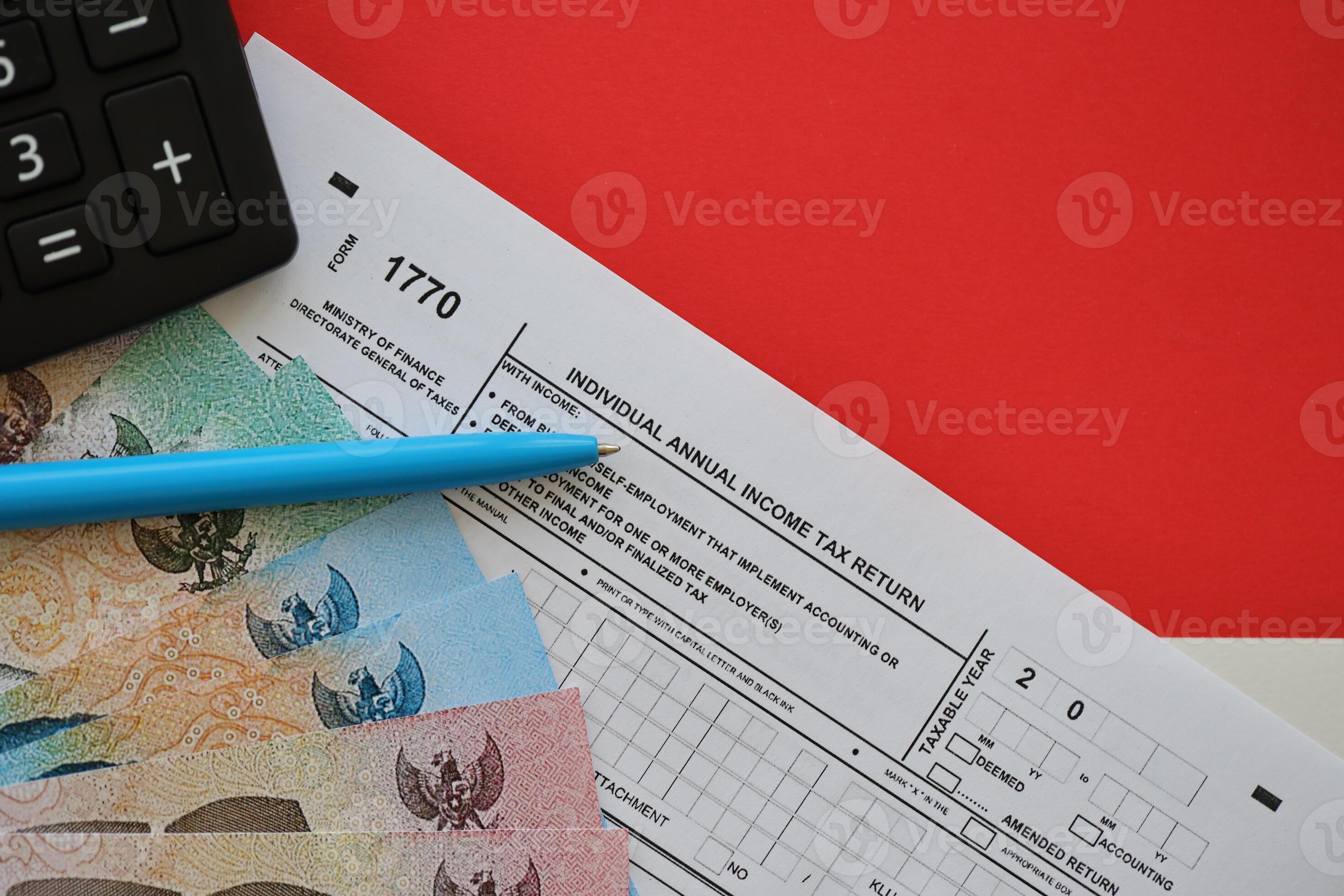 Indonesian tax form 1770 Individual Income Tax Return and pen on table 44418049 Stock Photo at ...