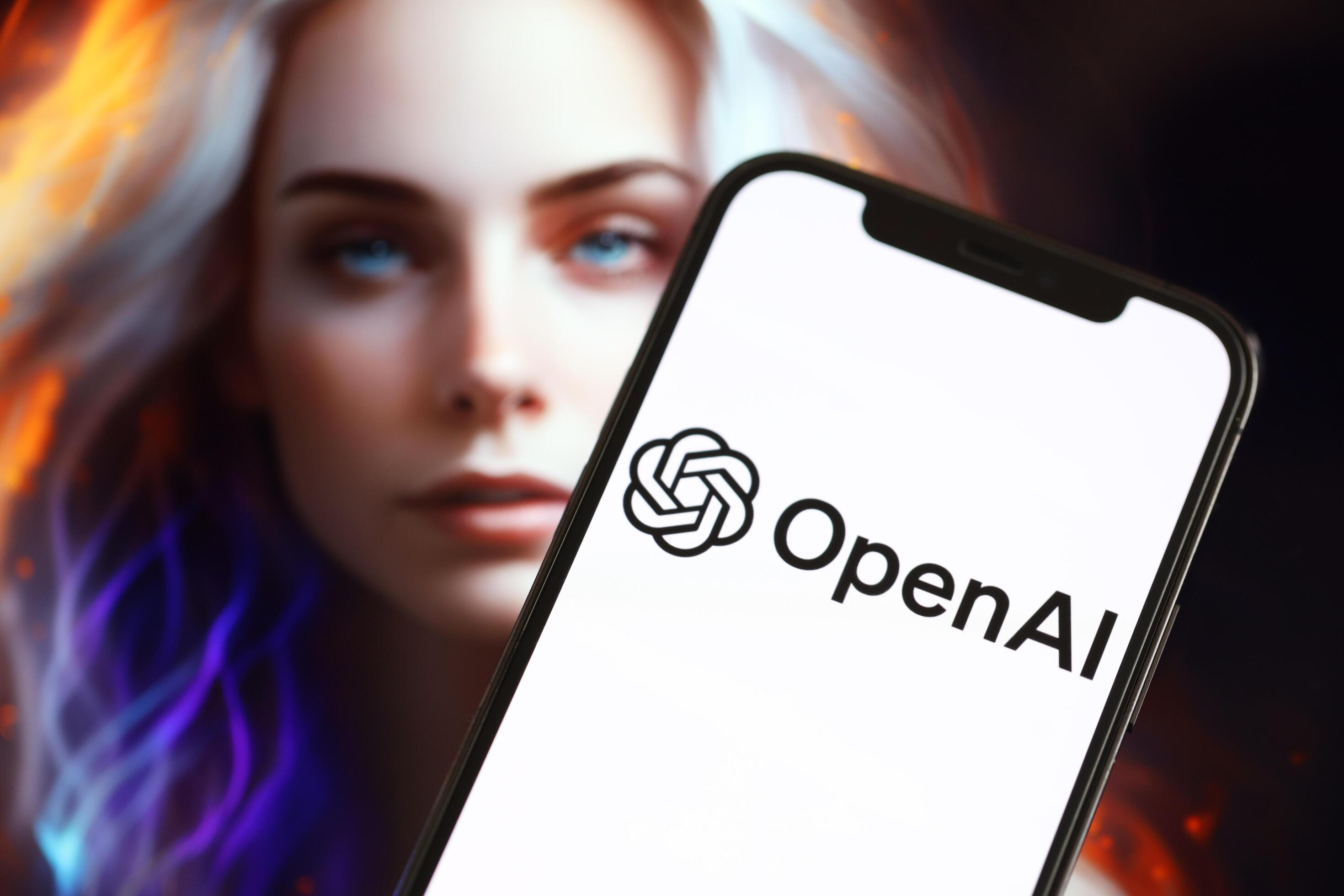 KYIV, UKRAINE - MARCH 17, 2024 OpenAI logo on iPhone display screen with background of ...