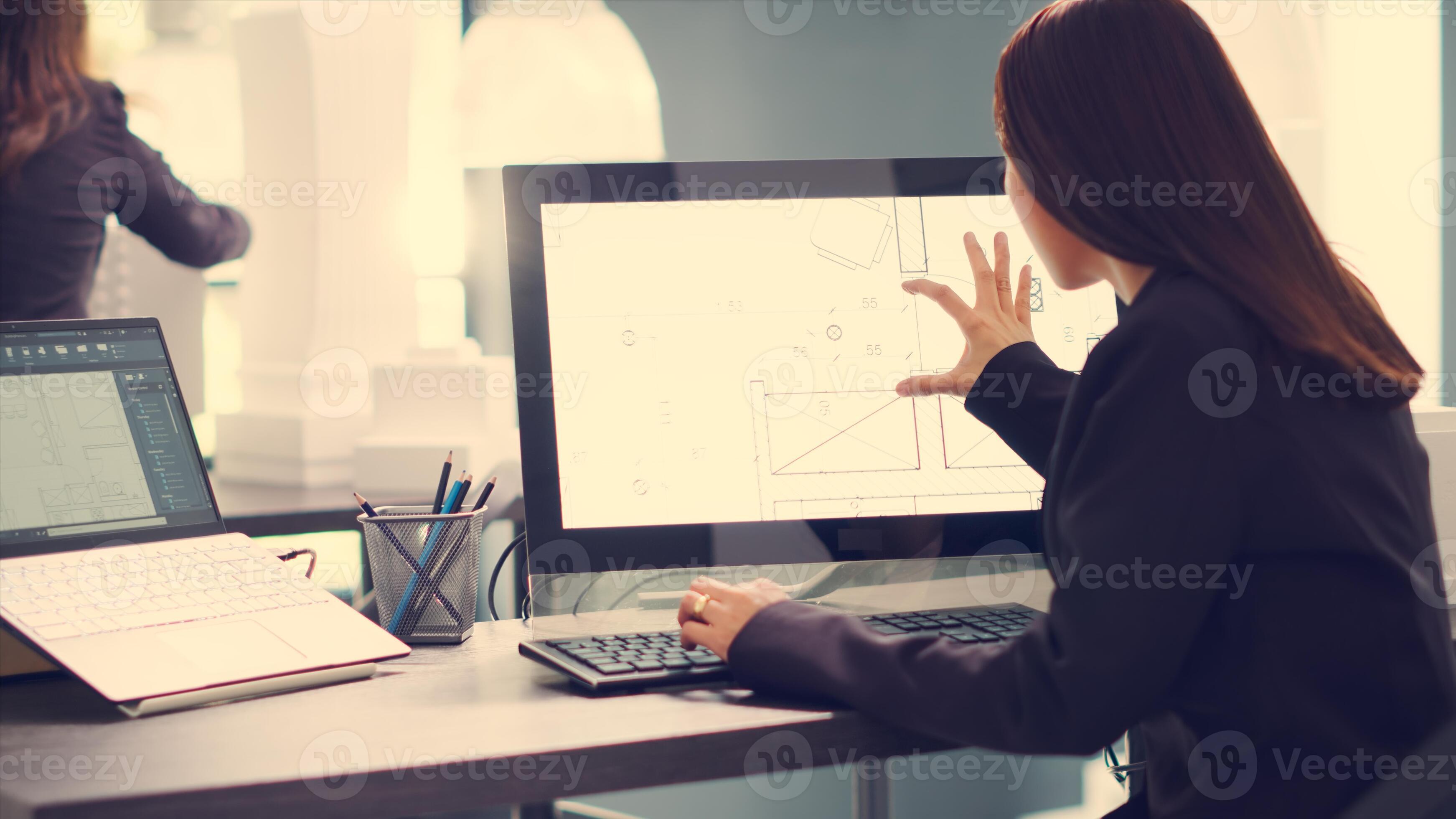 Architect designing blueprints for house remodeling project, using ...