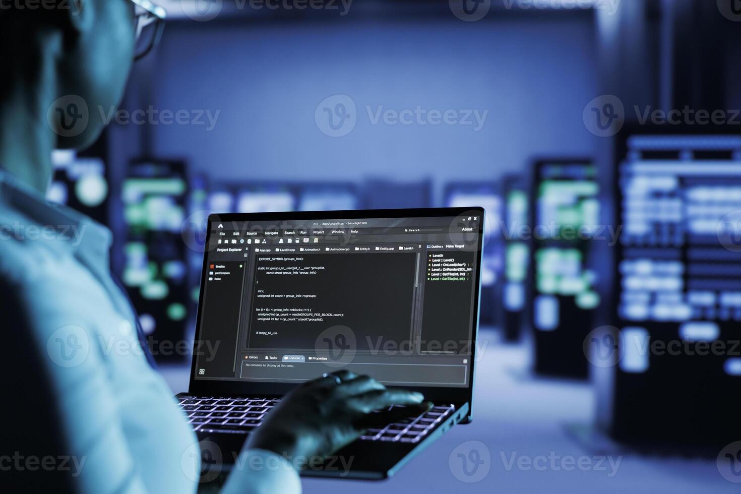 IT developer running code and programming on laptop, troubleshooting and upgrading high tech ...