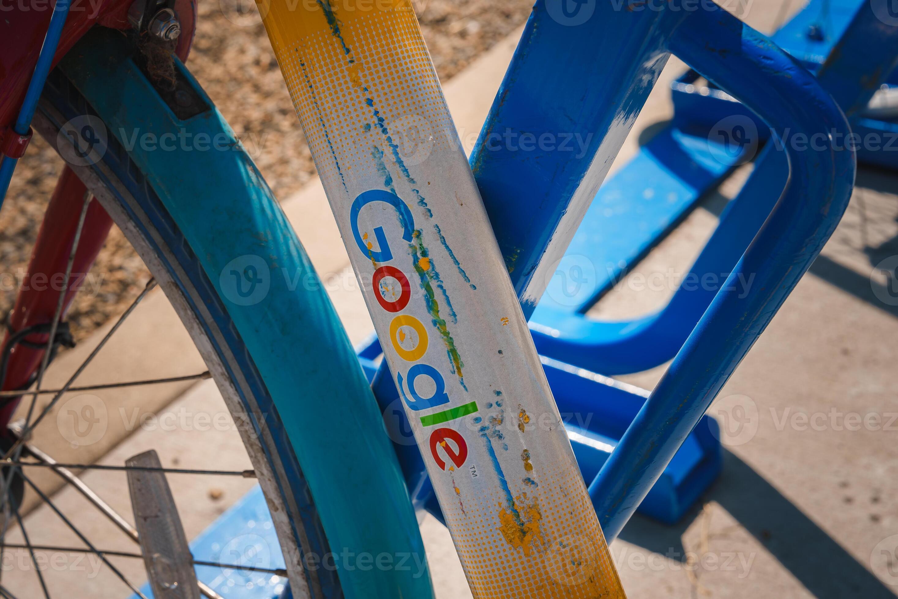 Colorful Google Logo Bicycle Frame Leaning on Blue Structure Outdoors ... Colorful Google Logo Bicycle Frame Leaning on Blue Structure Outdoors ...