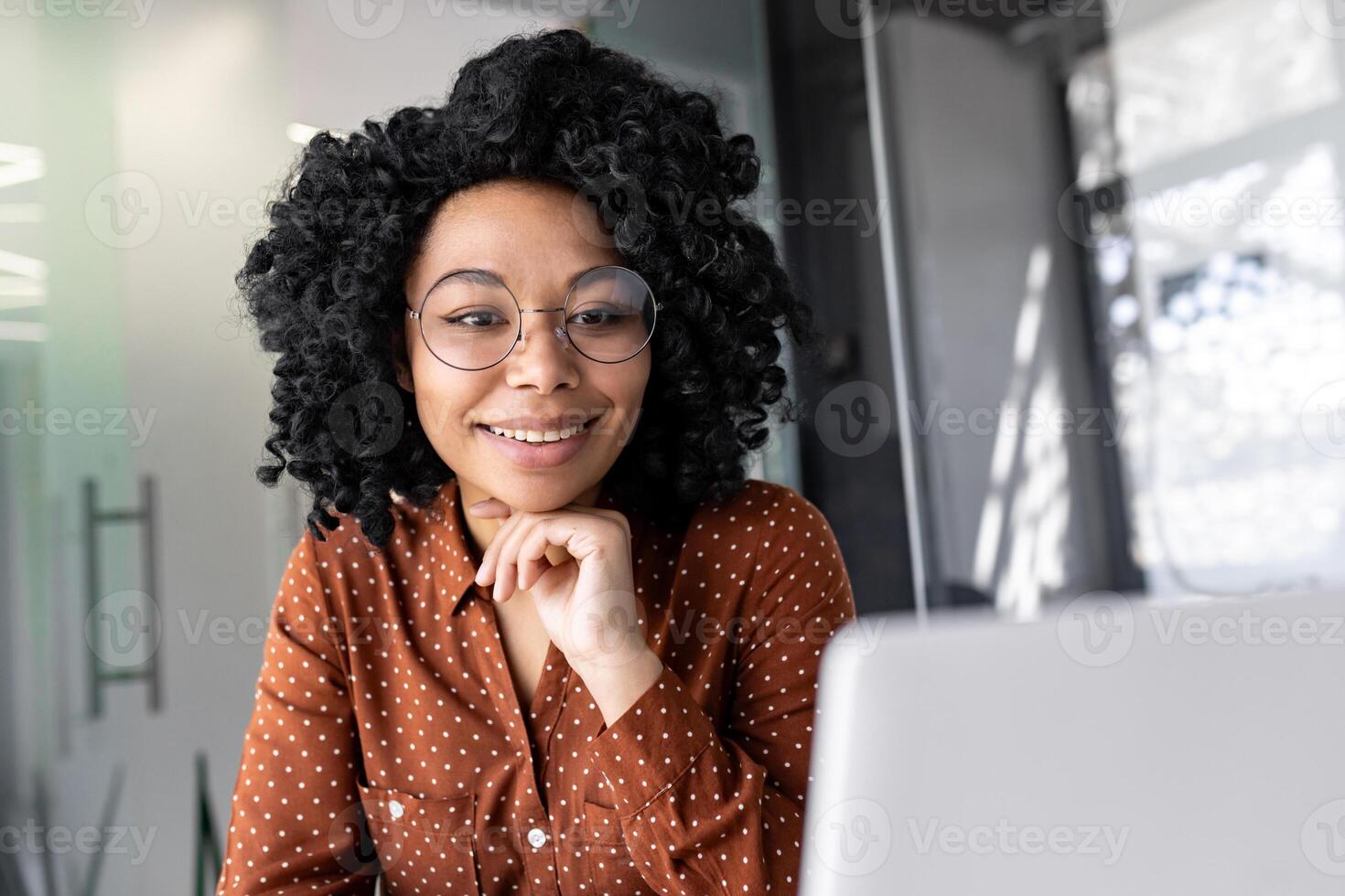 Young female employee programmer working at workplace inside office with laptop, business woman ...