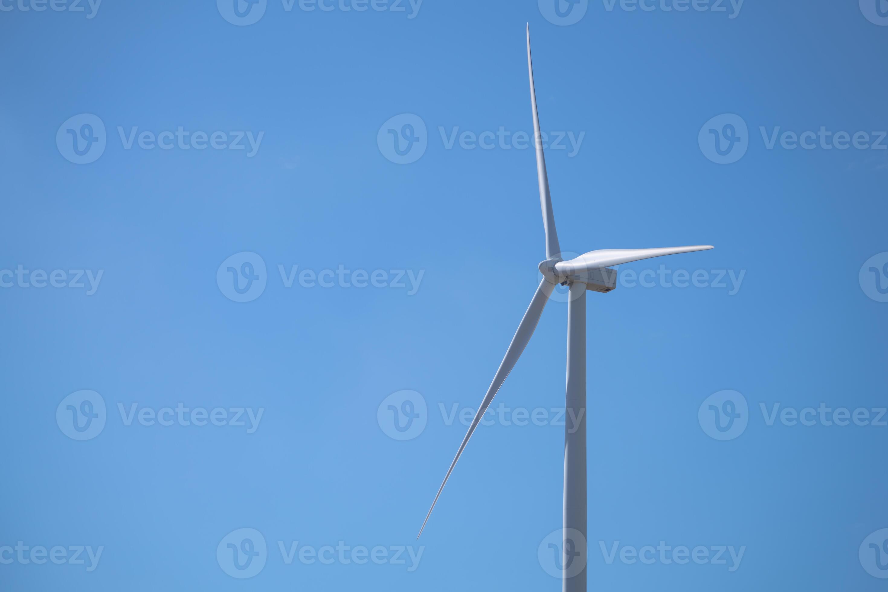 Wind turbine is standing tall in blue sky, Wind energy. Wind power ... Wind turbine is standing tall in blue sky, Wind energy. Wind power ...