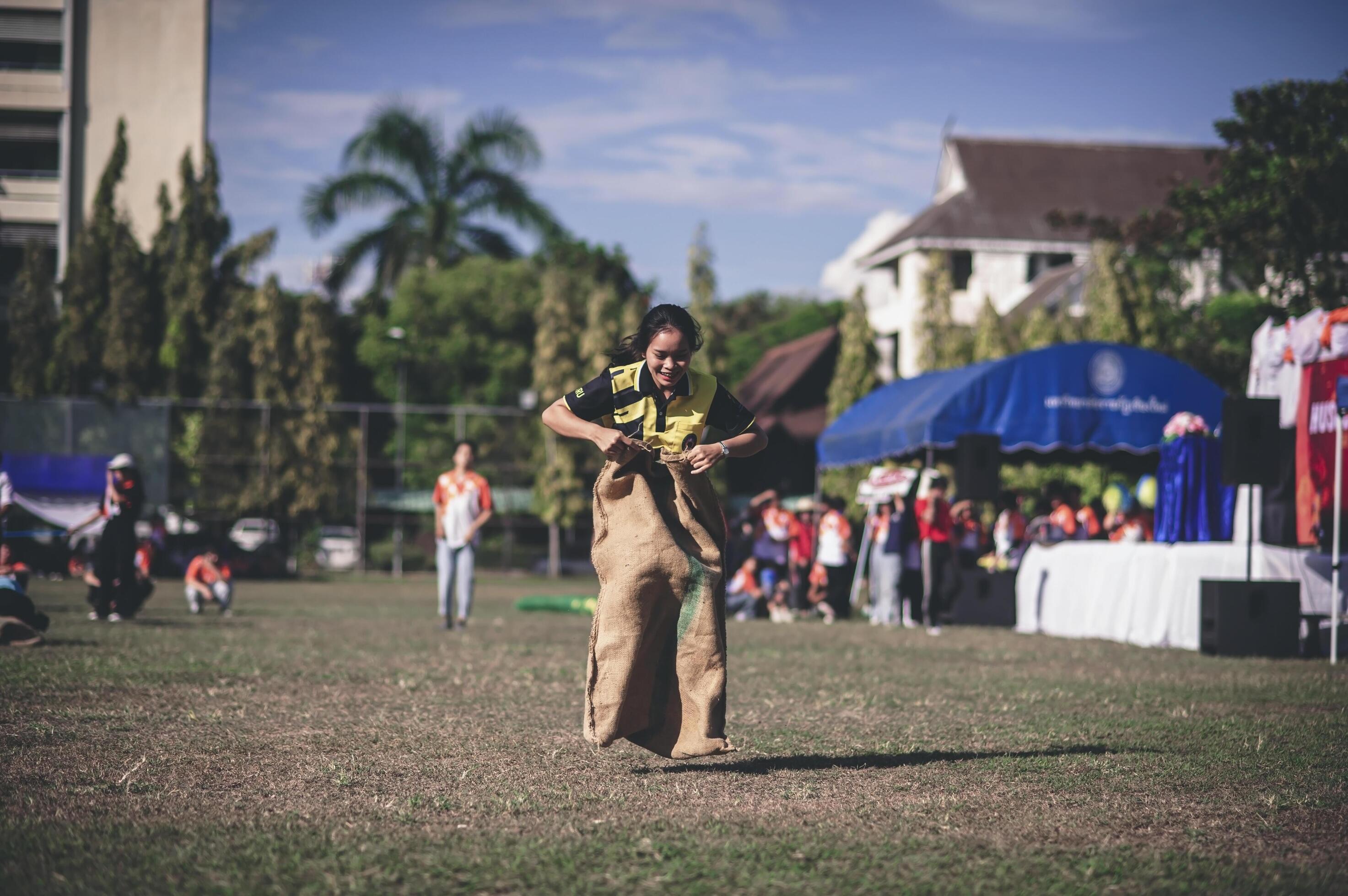 ChiangMai Thailand November 30 2022 Asian teenage students are doing a sack race for unity in ...