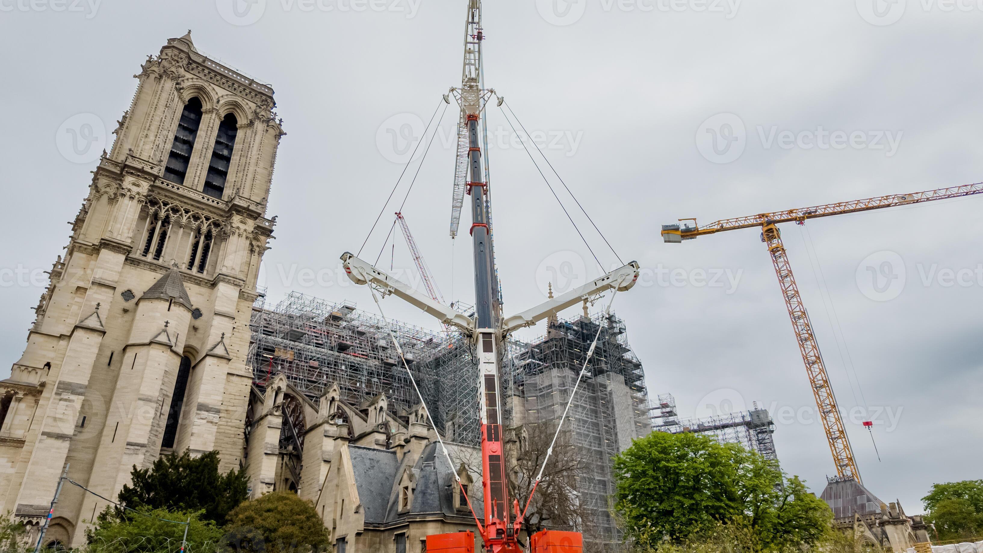 Restoration In Progress At Notre Dame Cathedral With Cranes And