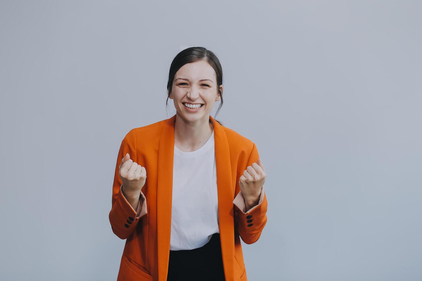 A Young Asian Woman With A Happy Successful Expression Wearing White