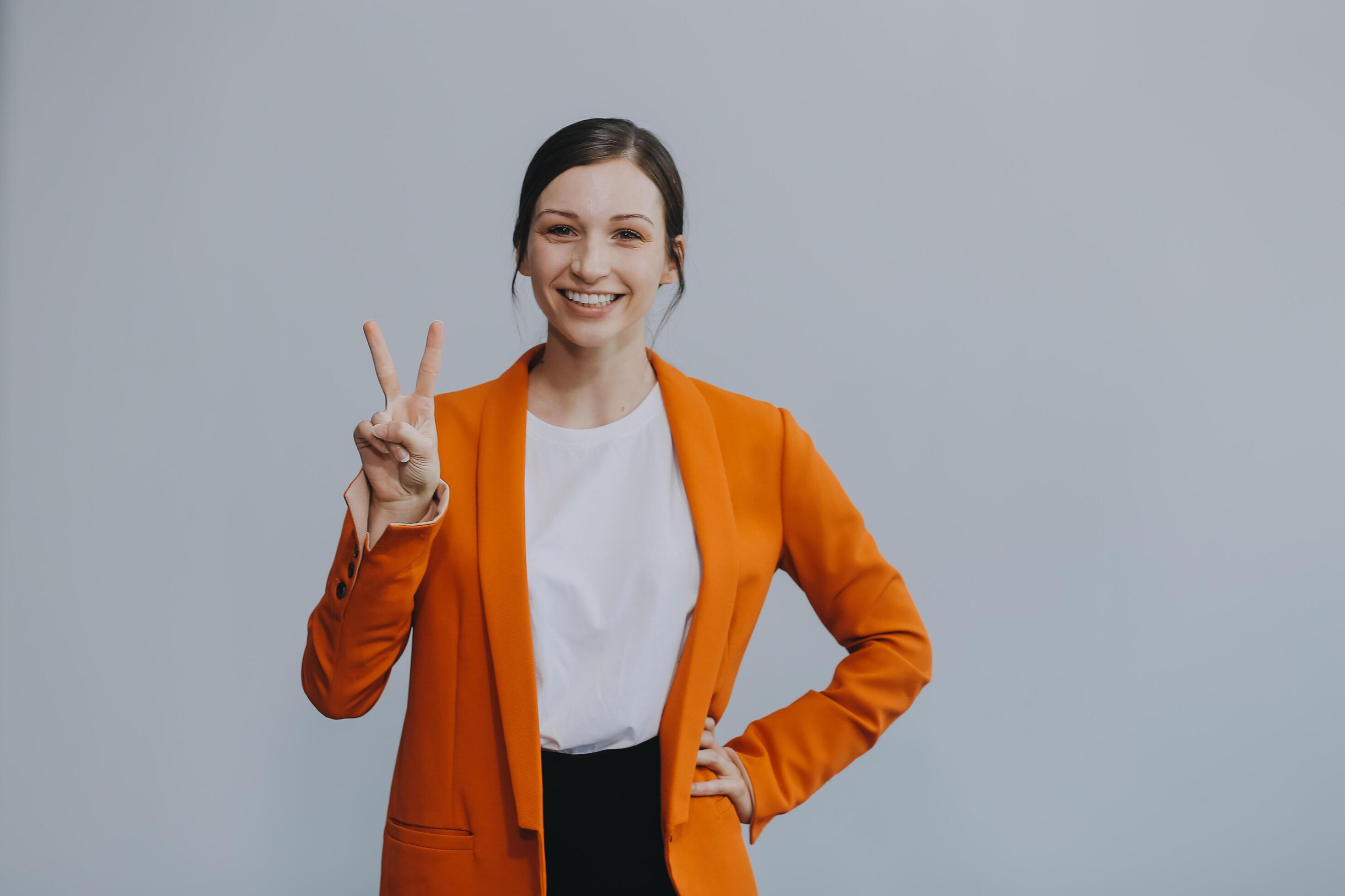 A Young Asian Woman With A Happy Successful Expression Wearing White