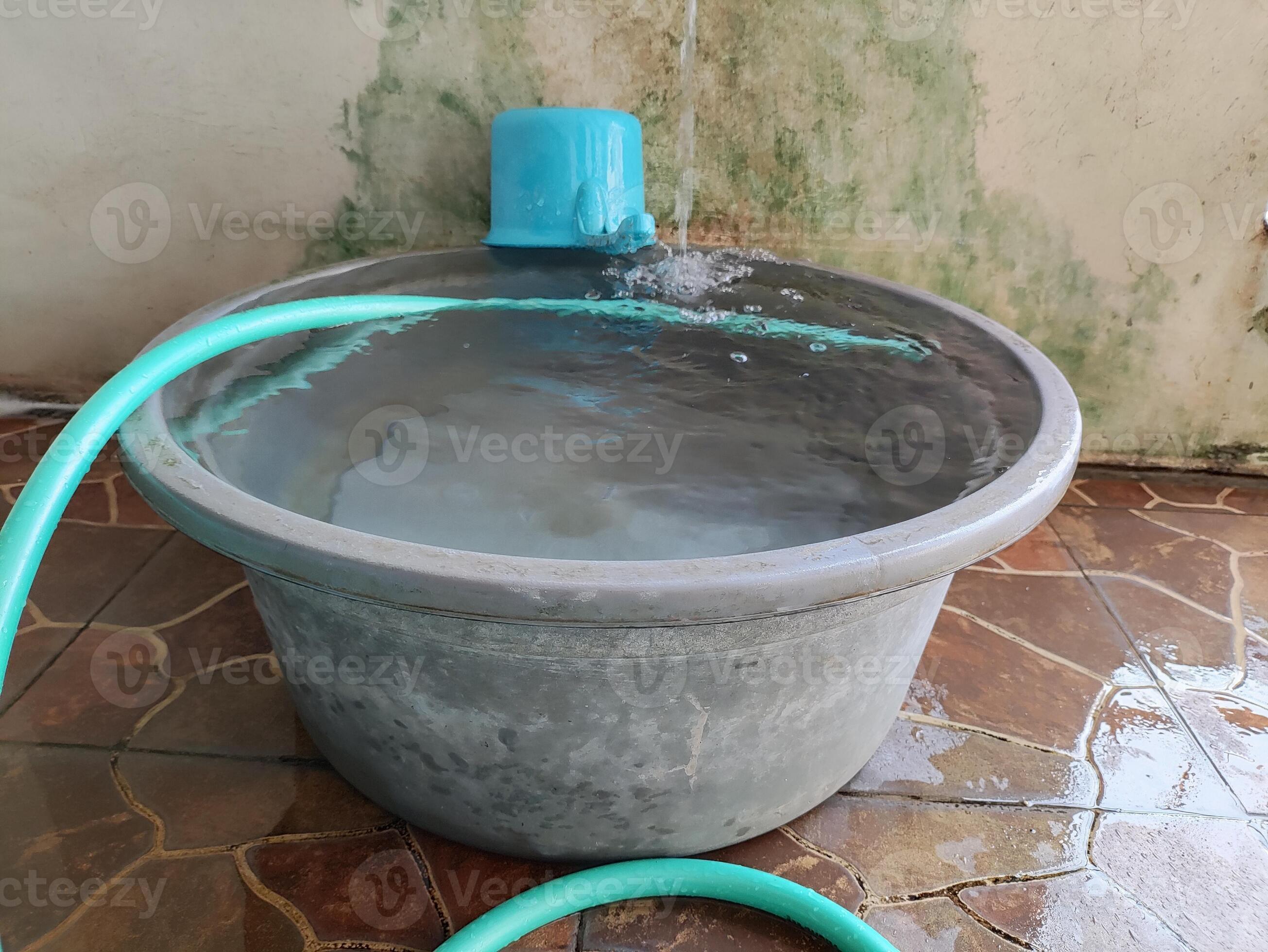 overflowing bucket full of water 45843690 Stock Photo at Vecteezy