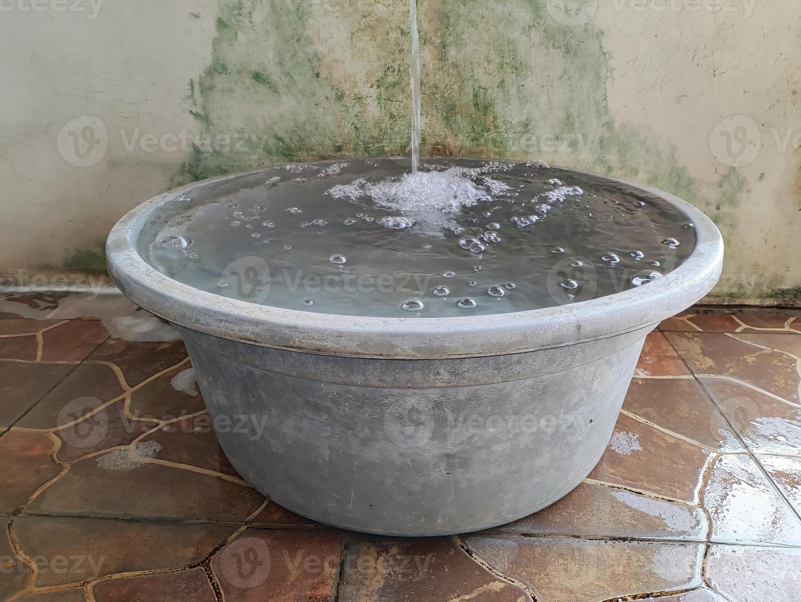 overflowing bucket full of water 45843717 Stock Photo at Vecteezy