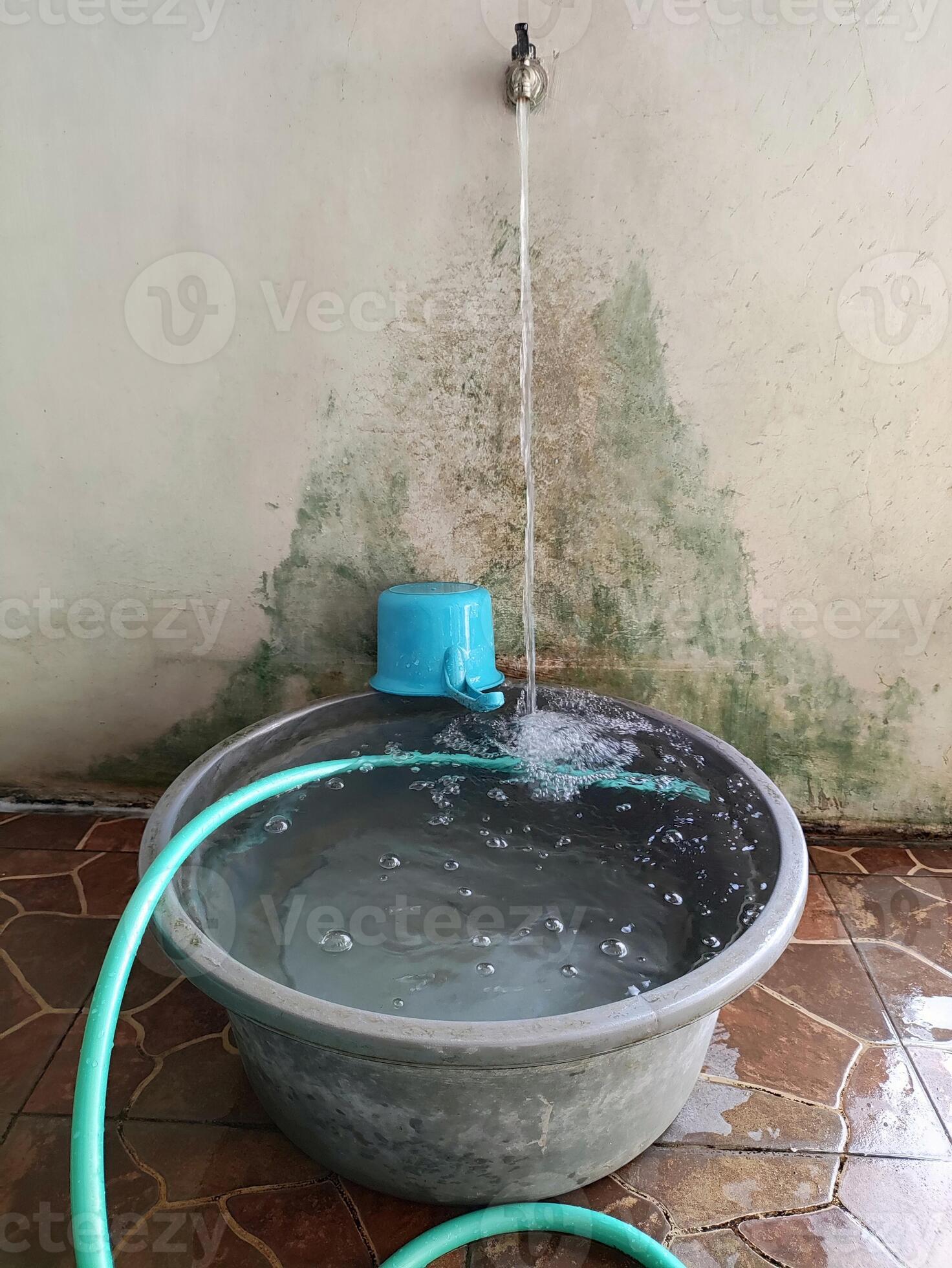 overflowing bucket full of water 45843725 Stock Photo at Vecteezy