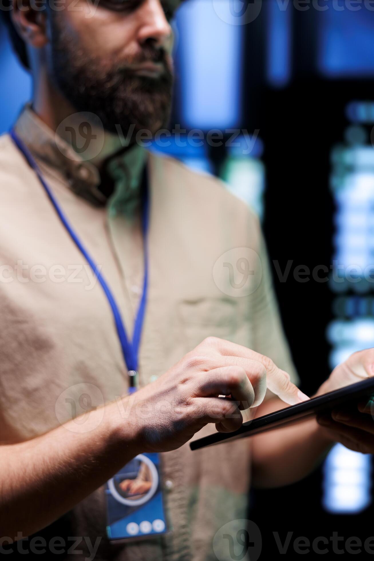 Manager In High Tech Facility Using Tablet To Patch Network Issues