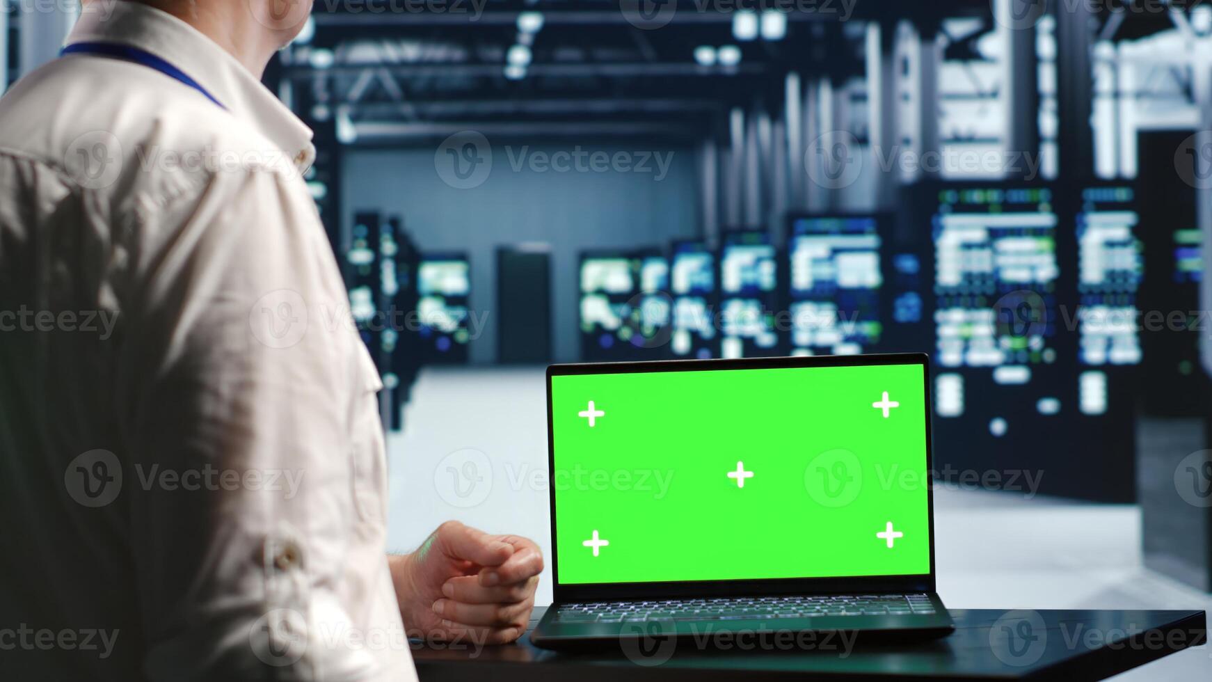 Programmer in server room expertly managing data while navigating ... Programmer in server room expertly managing data while navigating ...