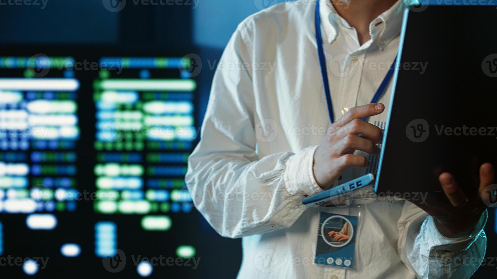 Skillful admin strolling through server rows providing processing resources for different ...