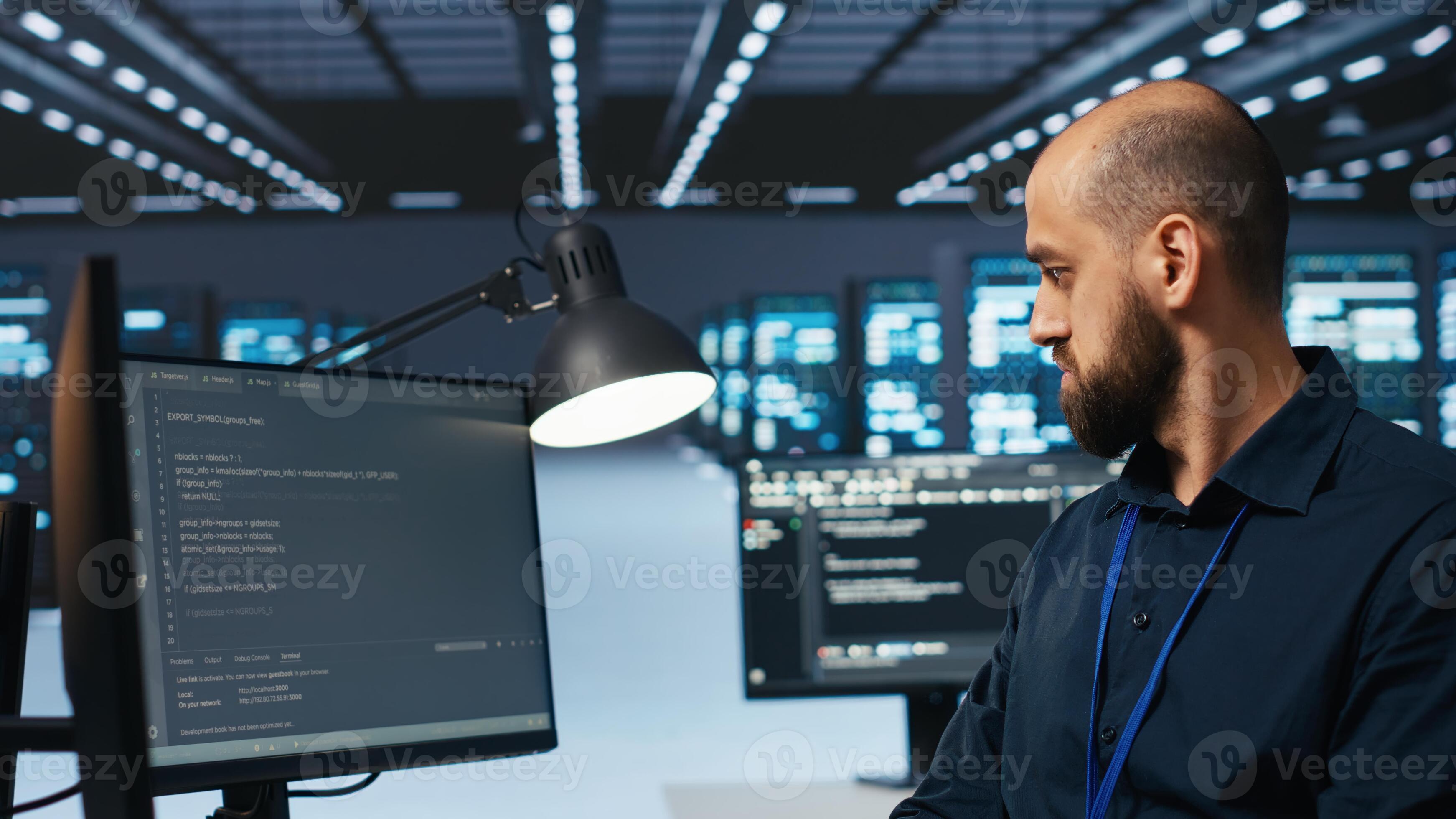 System Administrator In Server Hub Coding Ensuring Data Remains Shielded From Threats It