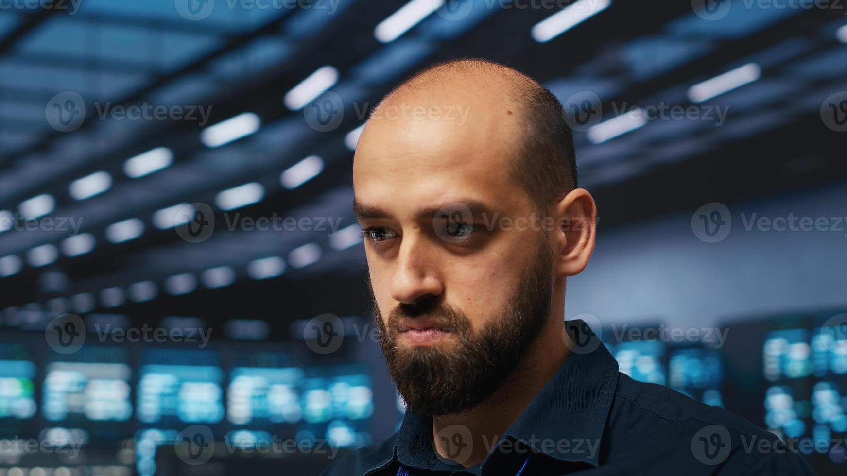 Admin in server hub writing code, ensuring data remains shielded from threats. Close up shot of ...