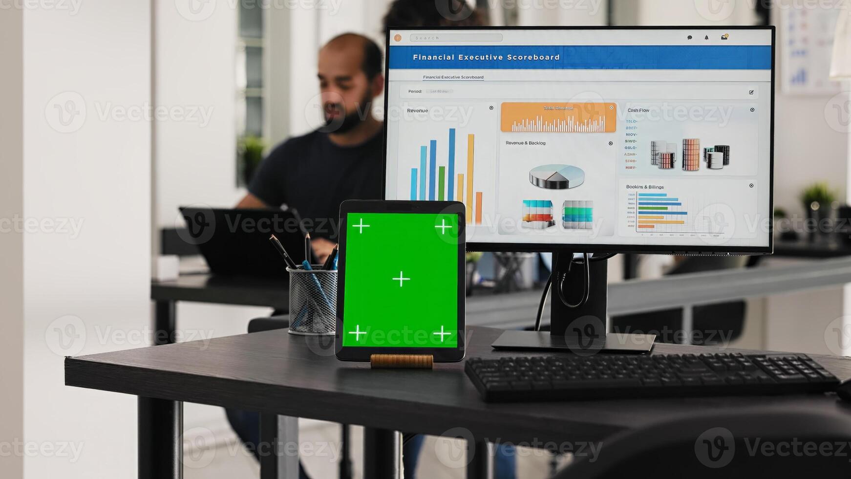 Empty Desk With Greenscreen Tablet And Computer Running Operational Data Coworking Space For