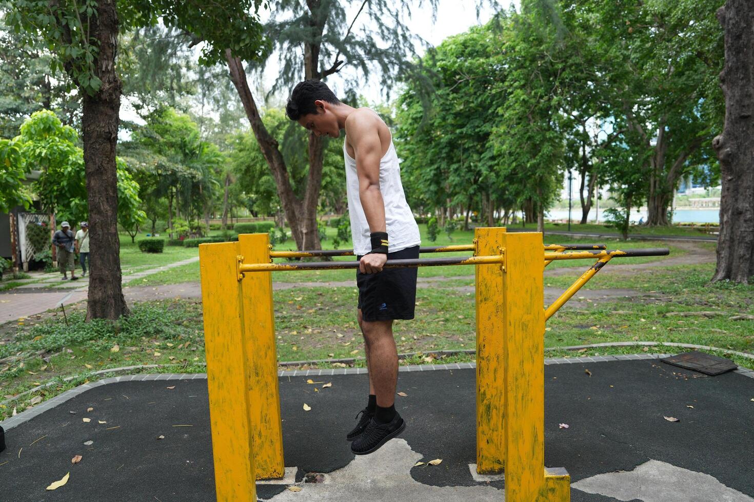 Asian Man Practicing Gymnastics Doing Gymnastics Bar And Hoop Exercises And Stretching Resting