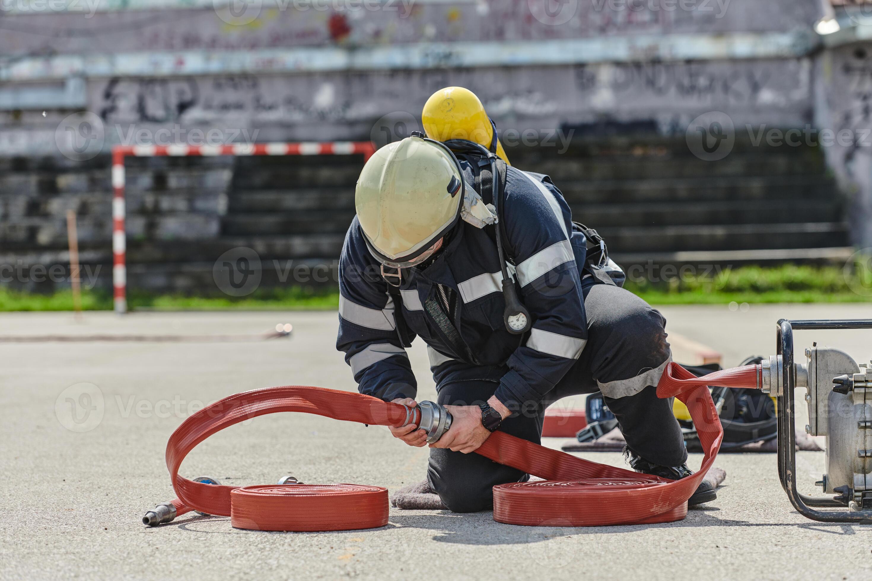 A firefighter dons the essential components of their professional gear ...