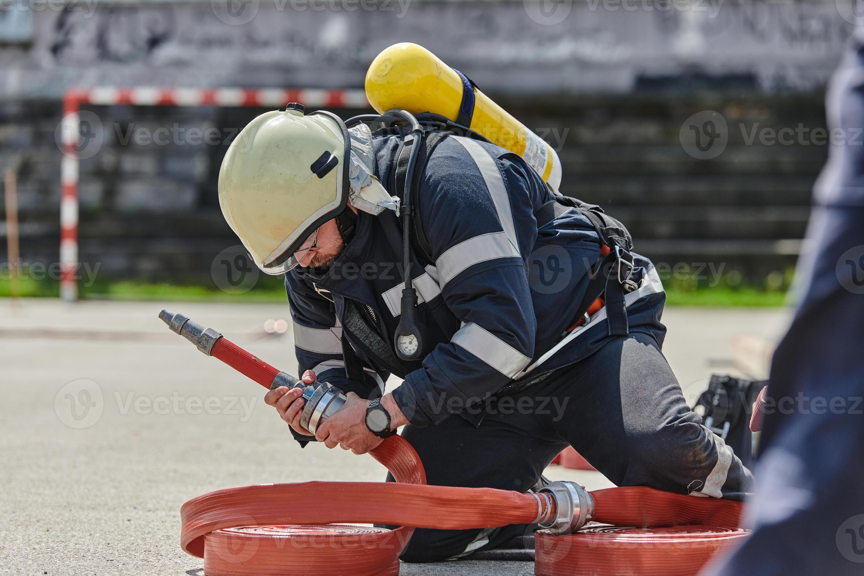 A firefighter dons the essential components of their professional gear ...
