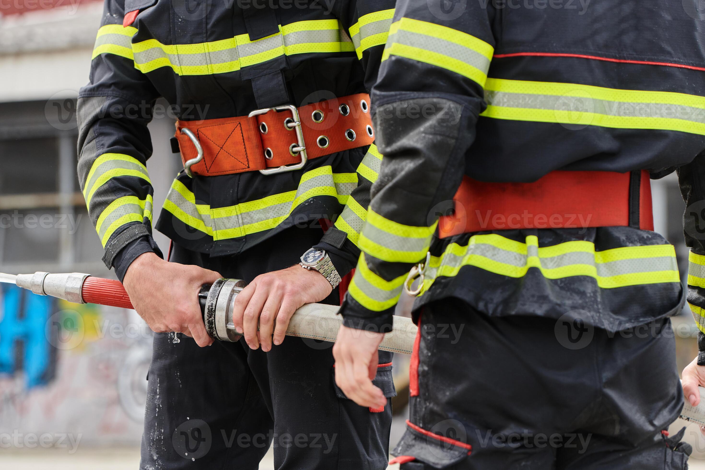 In a dynamic display of synchronized teamwork, firefighters hustle to ... In a dynamic display of synchronized teamwork, firefighters hustle to ...