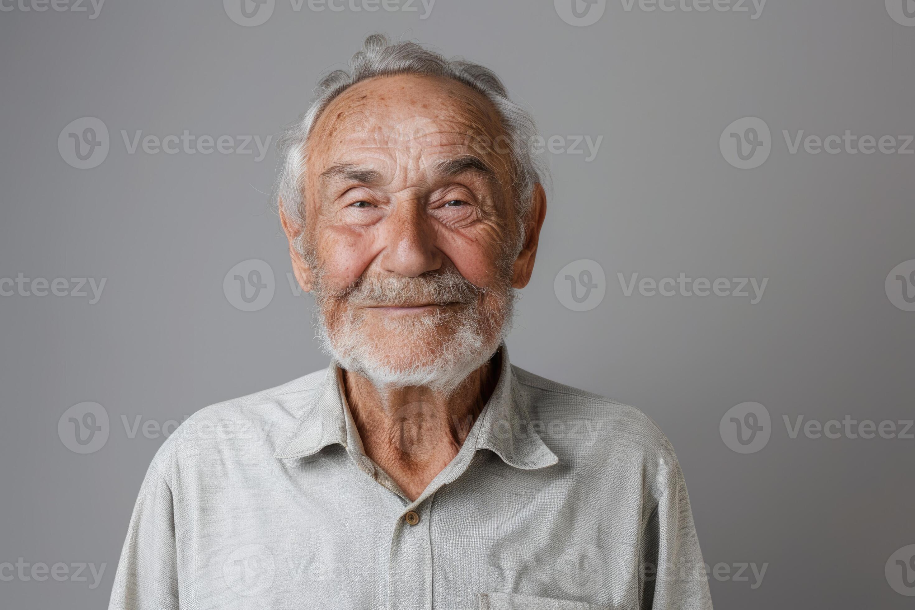 Happy older man in shirt smiling at camera on gray background. 46178758 Stock Photo at Vecteezy