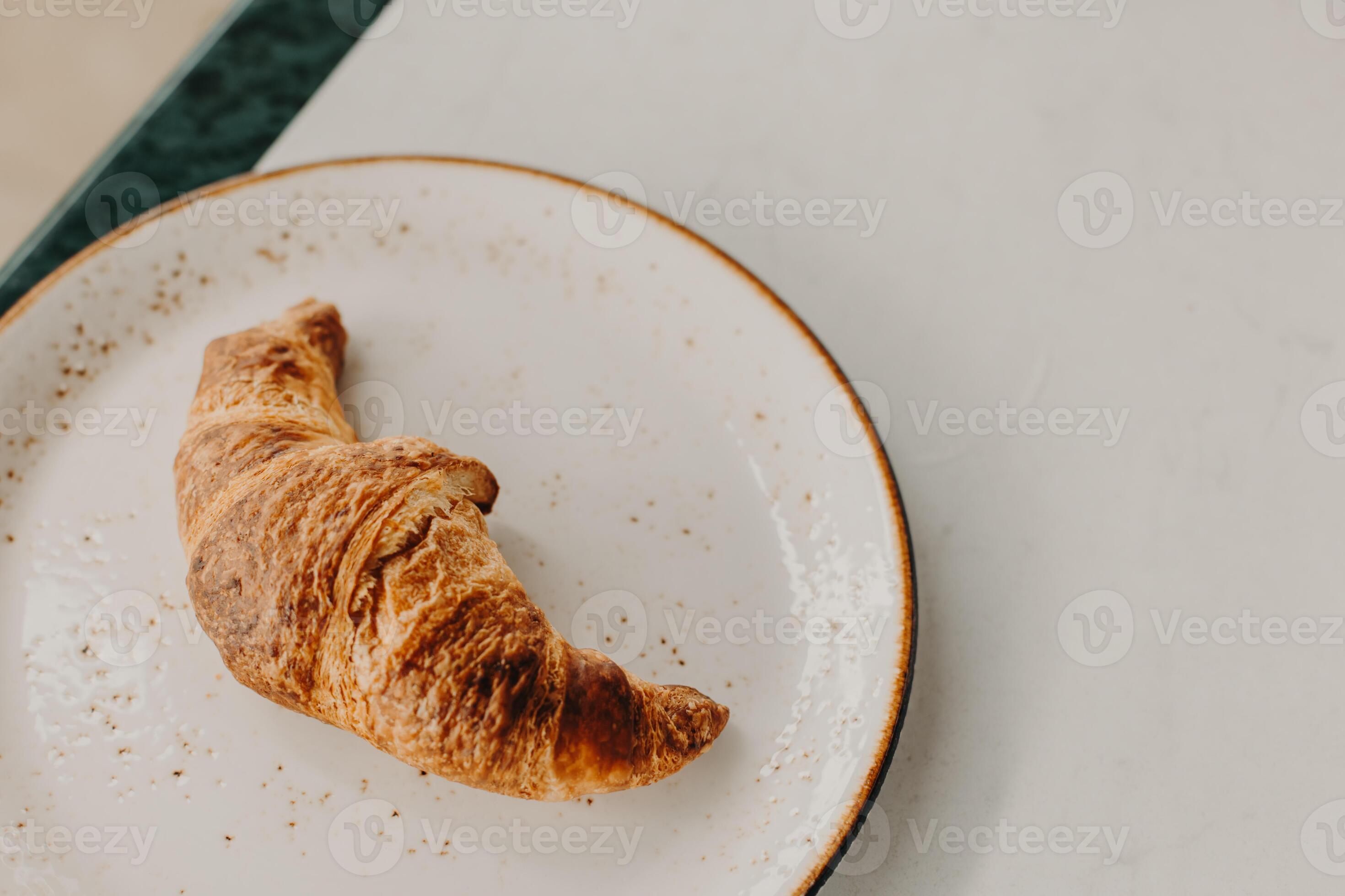 Tasty french croissant on a table in a street cafe. Selective focus. 46306196 Stock Photo at ...
