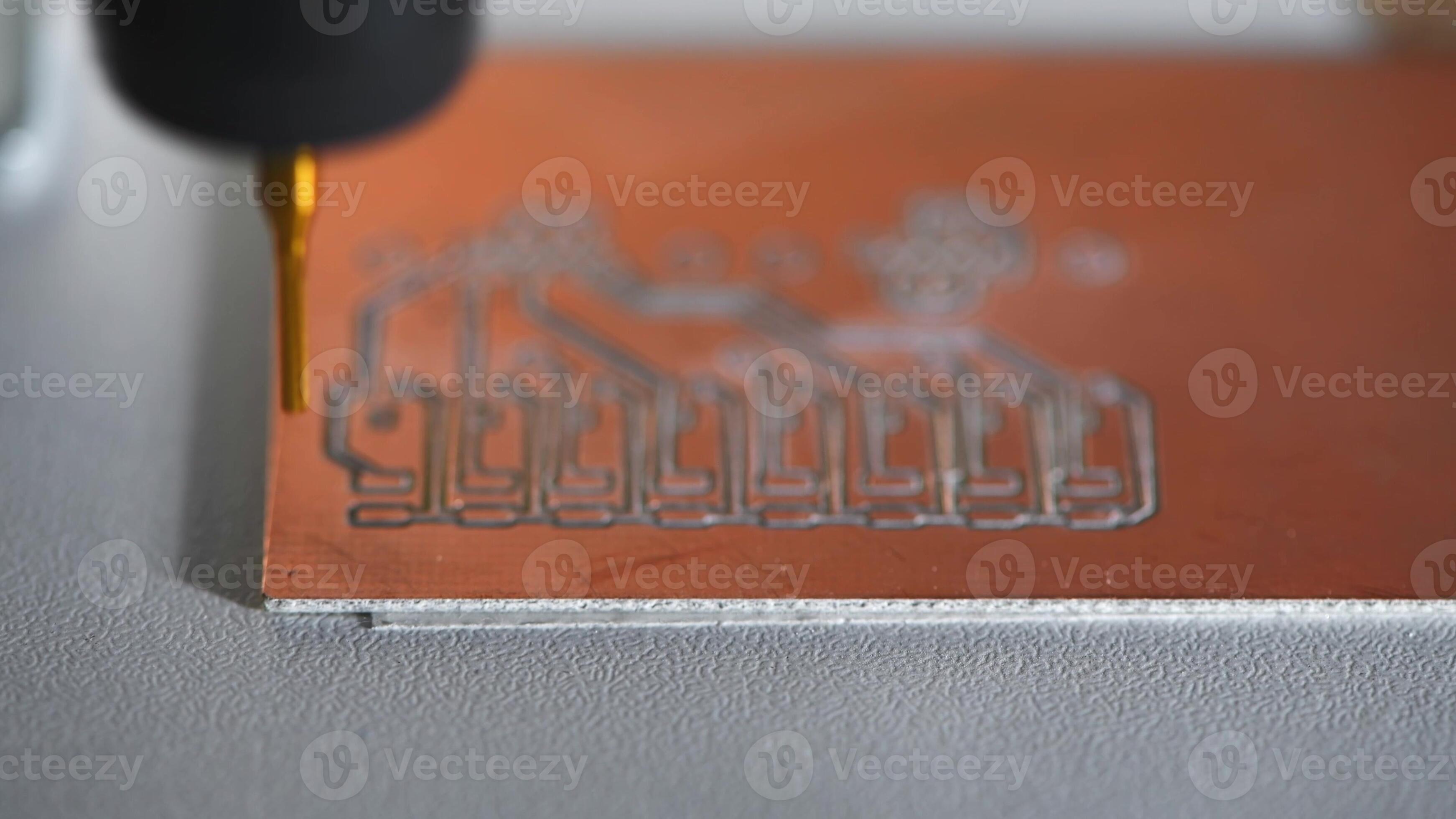 machine with numerical control CNC carries out milling of printed ...