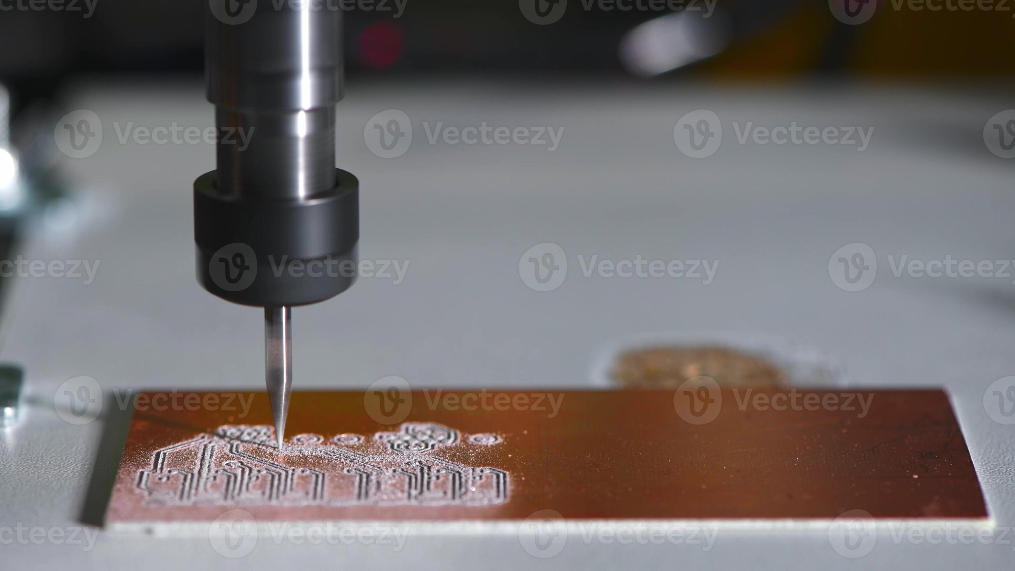 machine with numerical control CNC carries out milling of printed ...