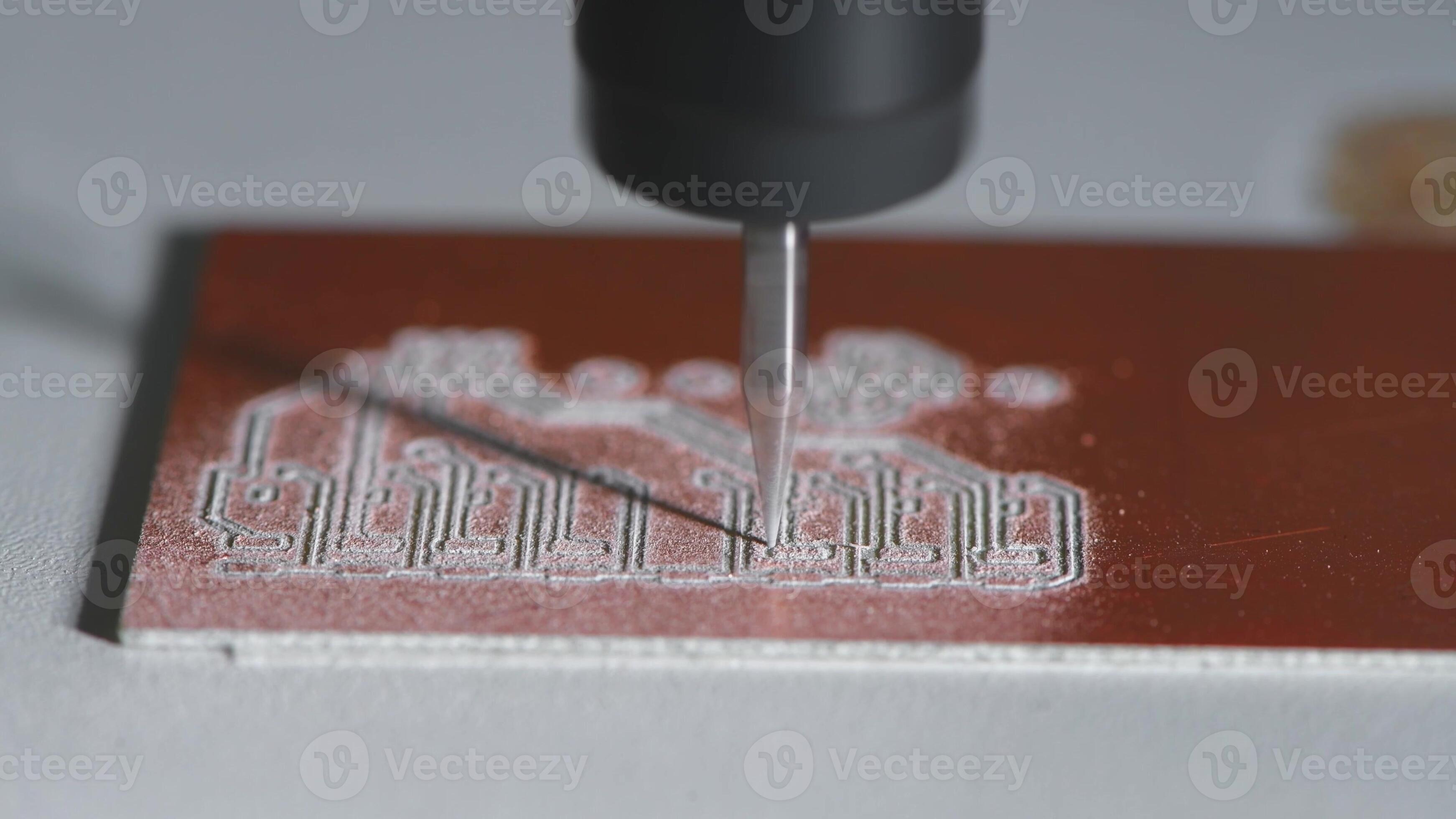 machine with numerical control CNC carries out milling of printed ...