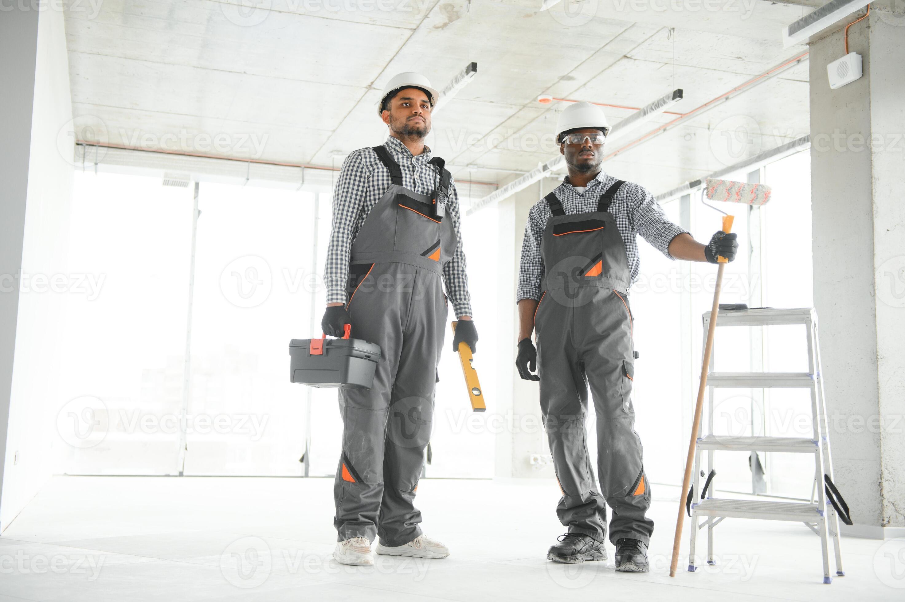 multicultural builders in hardhats at construction site 46388097 Stock Photo at Vecteezy
