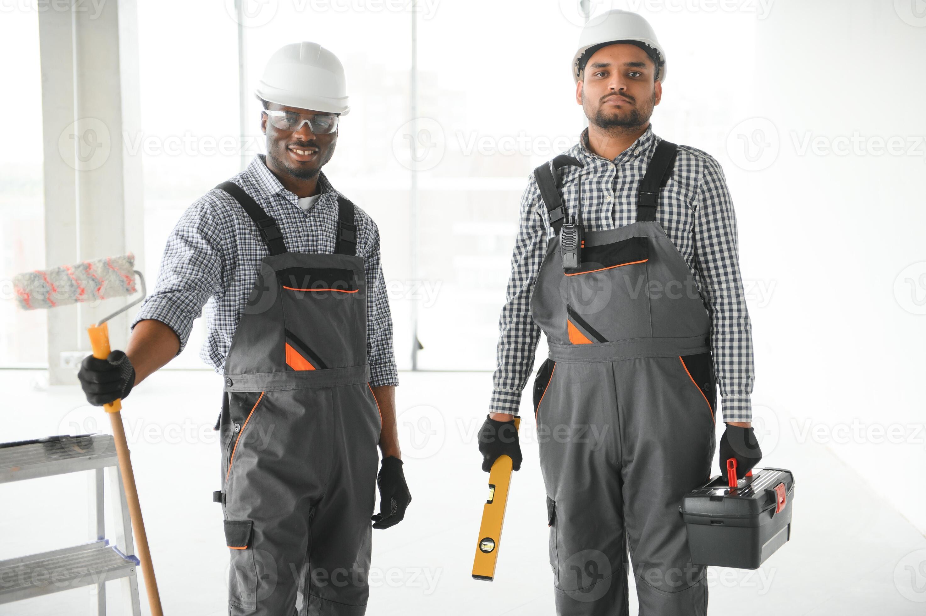 multicultural builders in hardhats at construction site 46388100 Stock Photo at Vecteezy