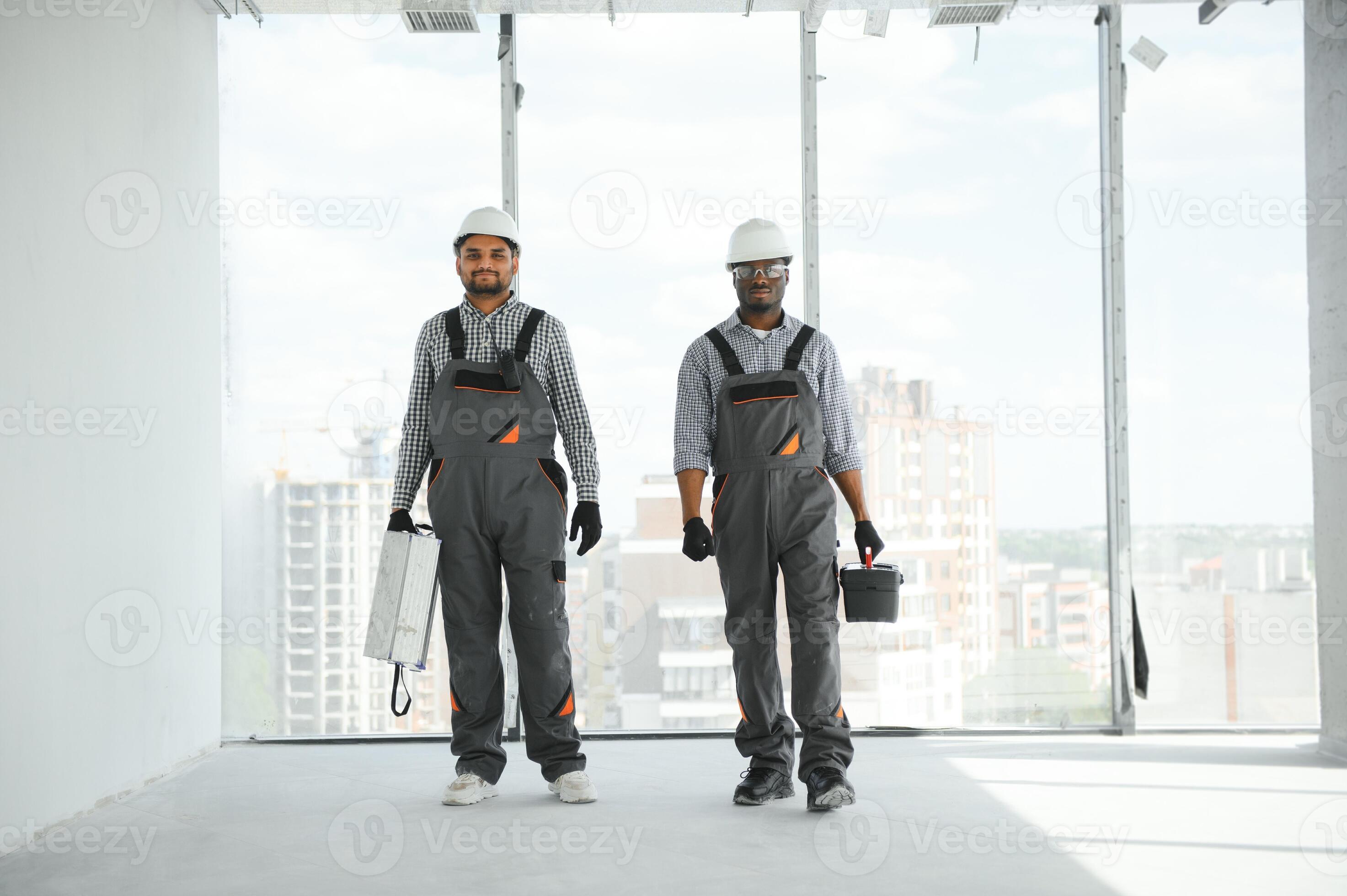 multicultural builders in hardhats at construction site 46388109 Stock Photo at Vecteezy