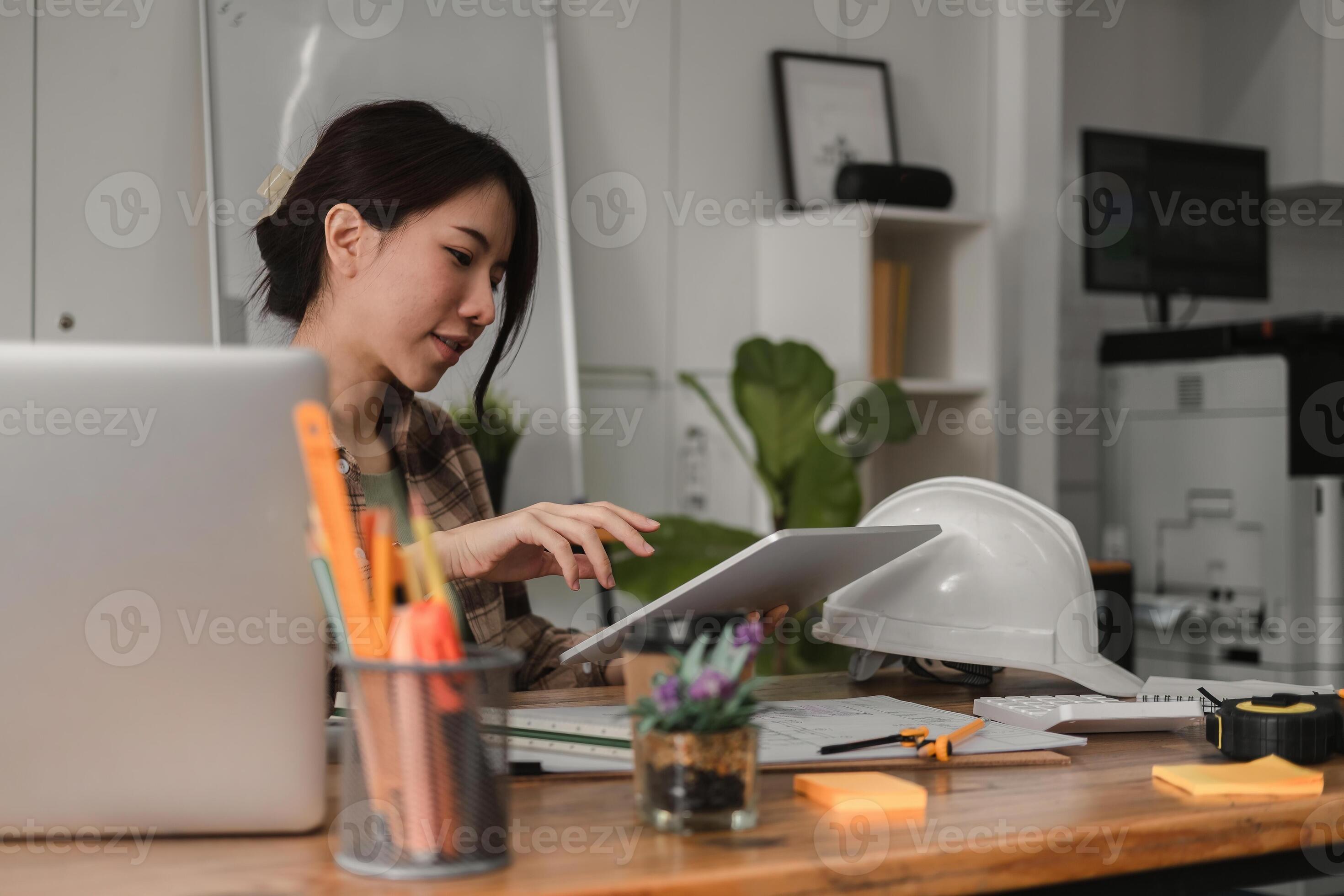 Woman architect designer structural engineer working office looking ...