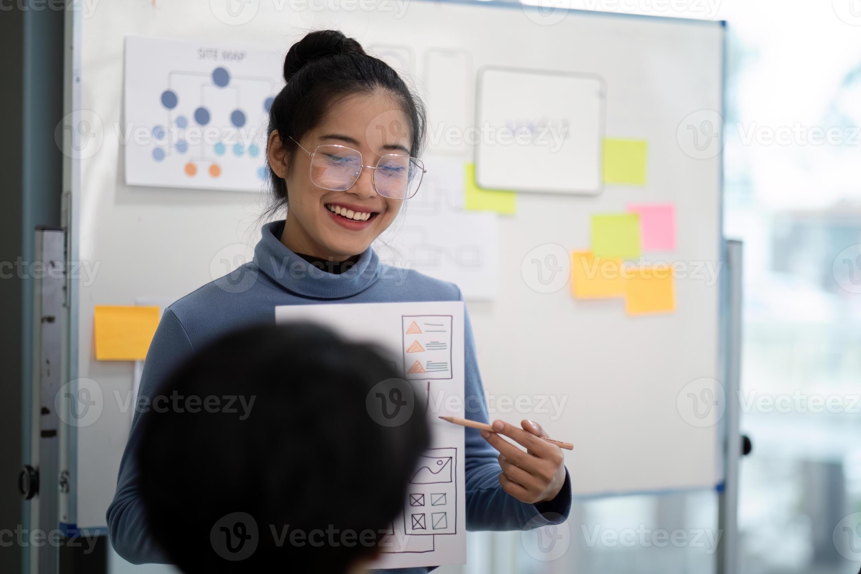 Creative Ux Developer And Ui Designer Brainstorming Session With Wireframes And Flowcharts On